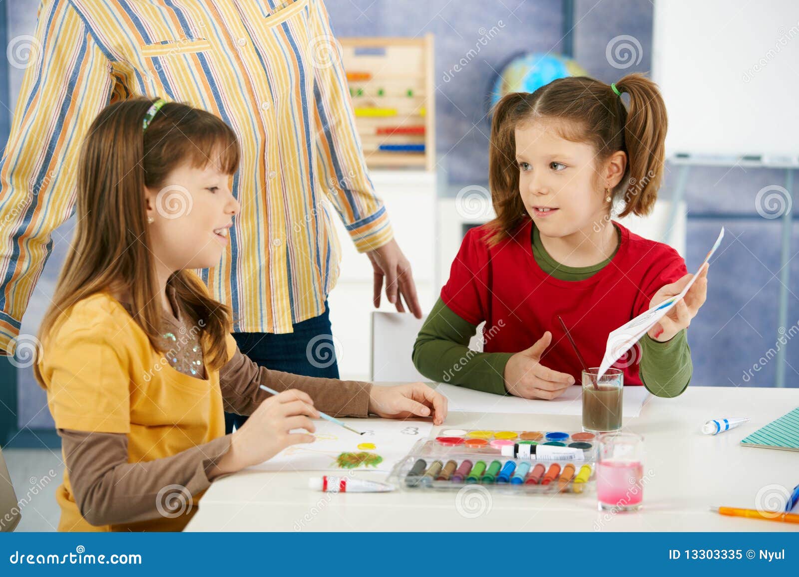 Elementary Age Children Painting in Classroom Stock Image - Image of ...