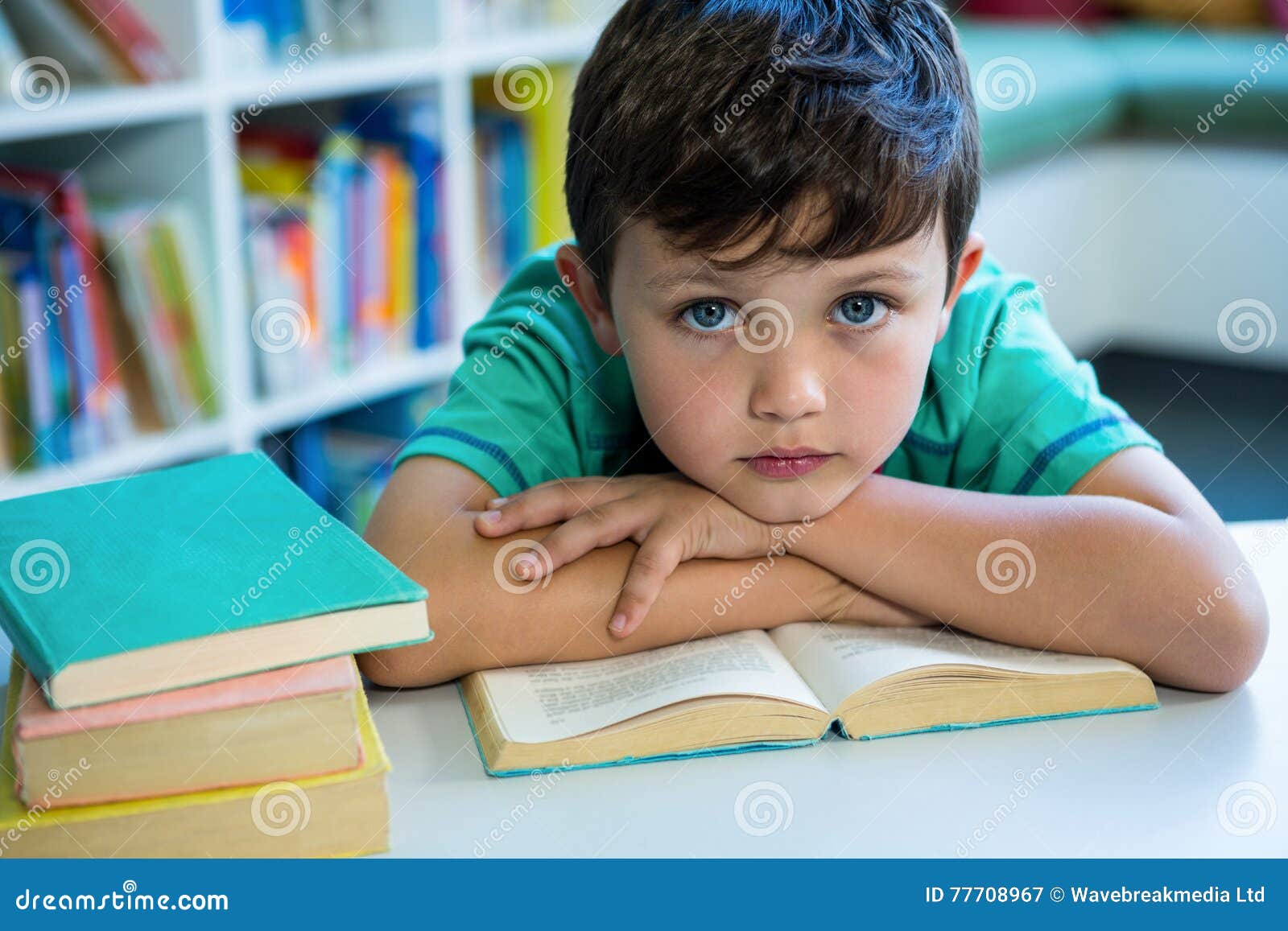 Elementary Boy with Book in School Library Stock Image - Image of ...