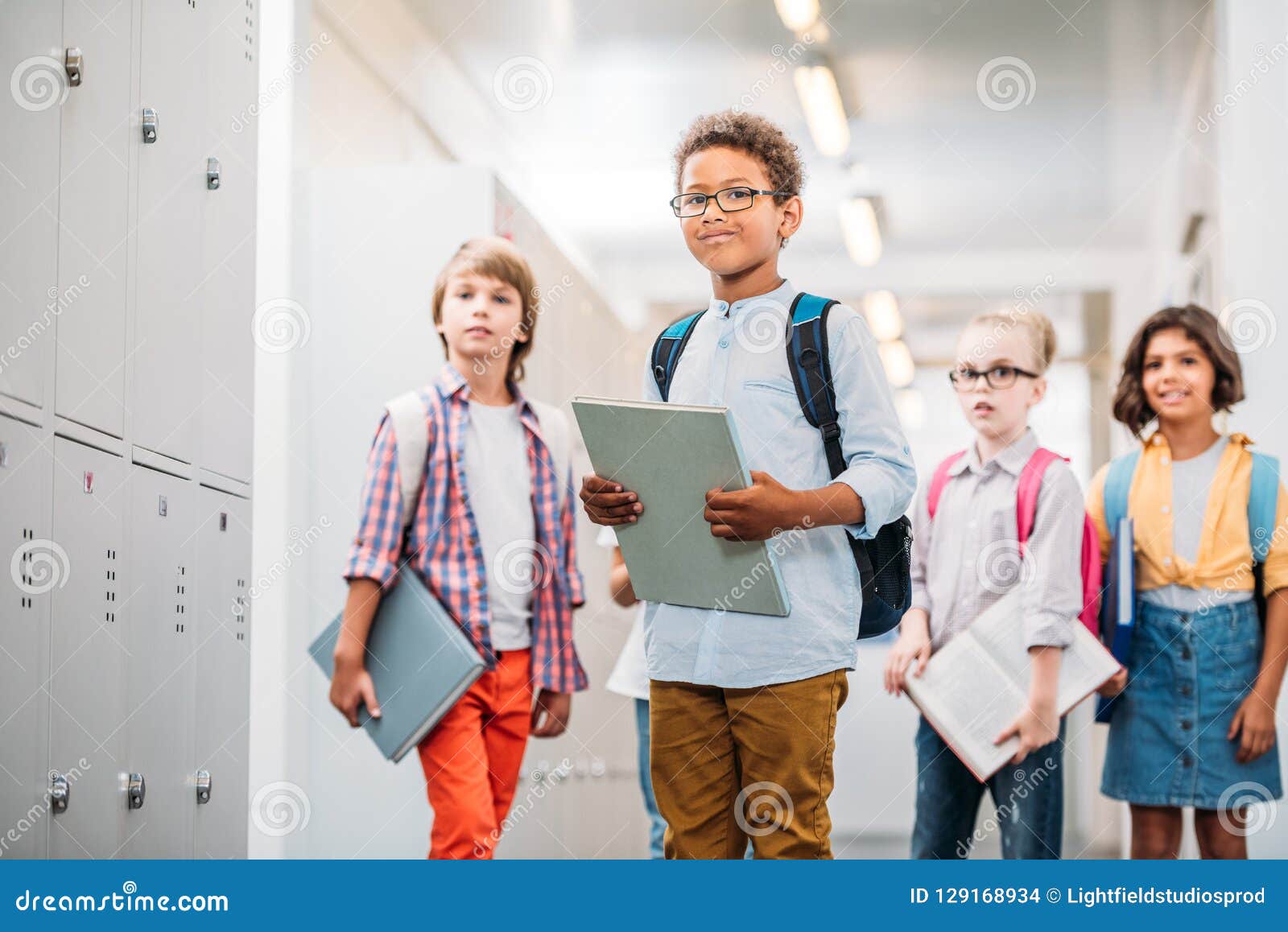 Cute Elementary Kids with Books Stock Photo - Image of lecture, school ...