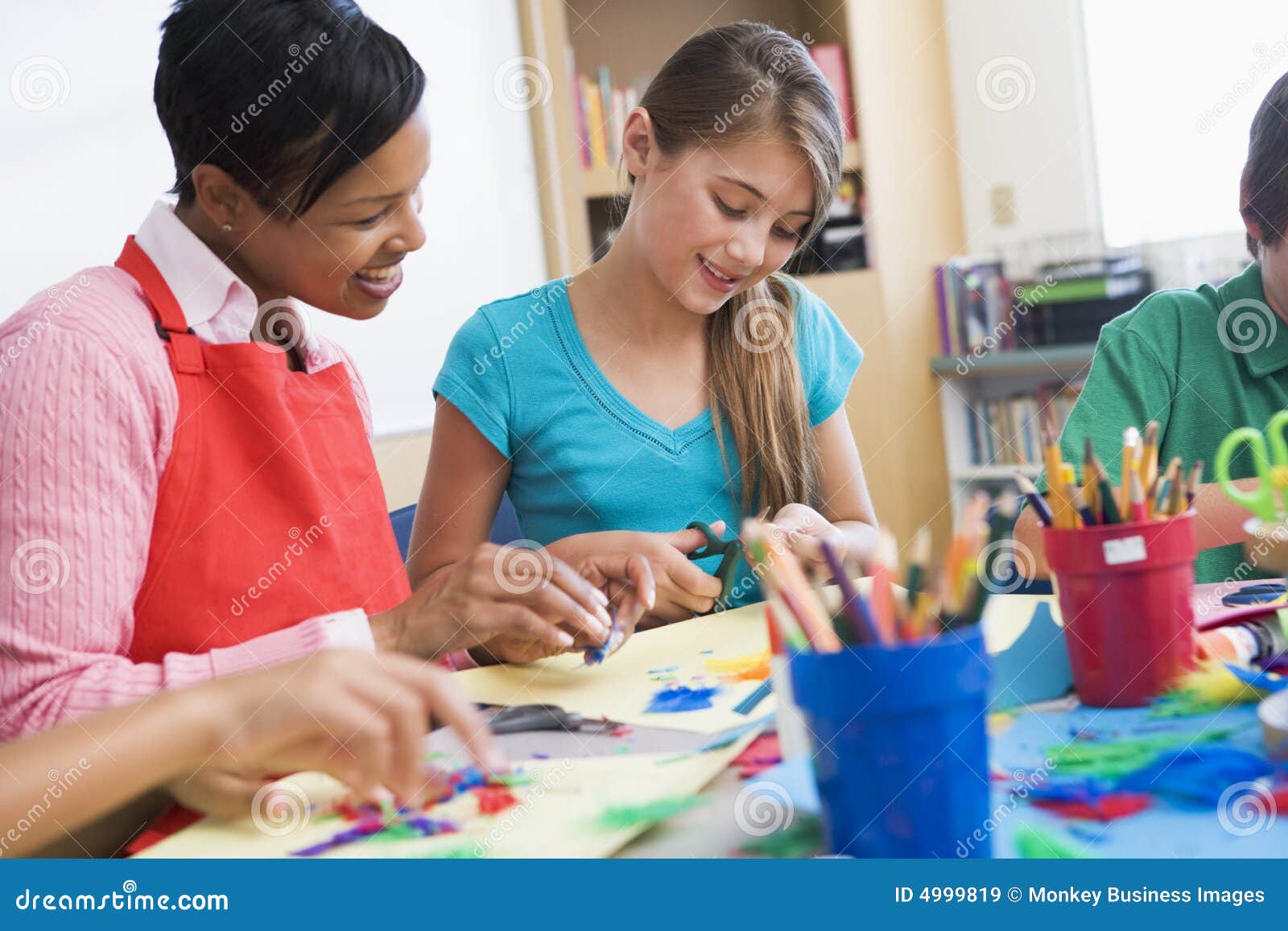 Elementary Pupil Showing Drawing To Classmates In Classroom Royalty ...
