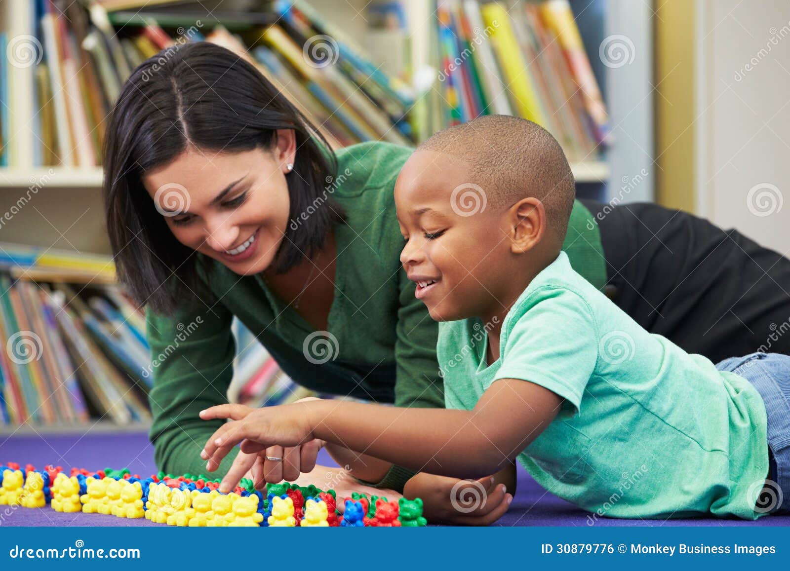 Elementary Pupil Counting with Teacher in Classroom Stock Photo - Image ...