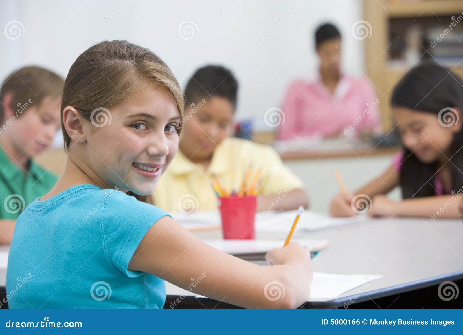 Elementary Pupil in School Classroom Stock Photo - Image of ethnicity ...