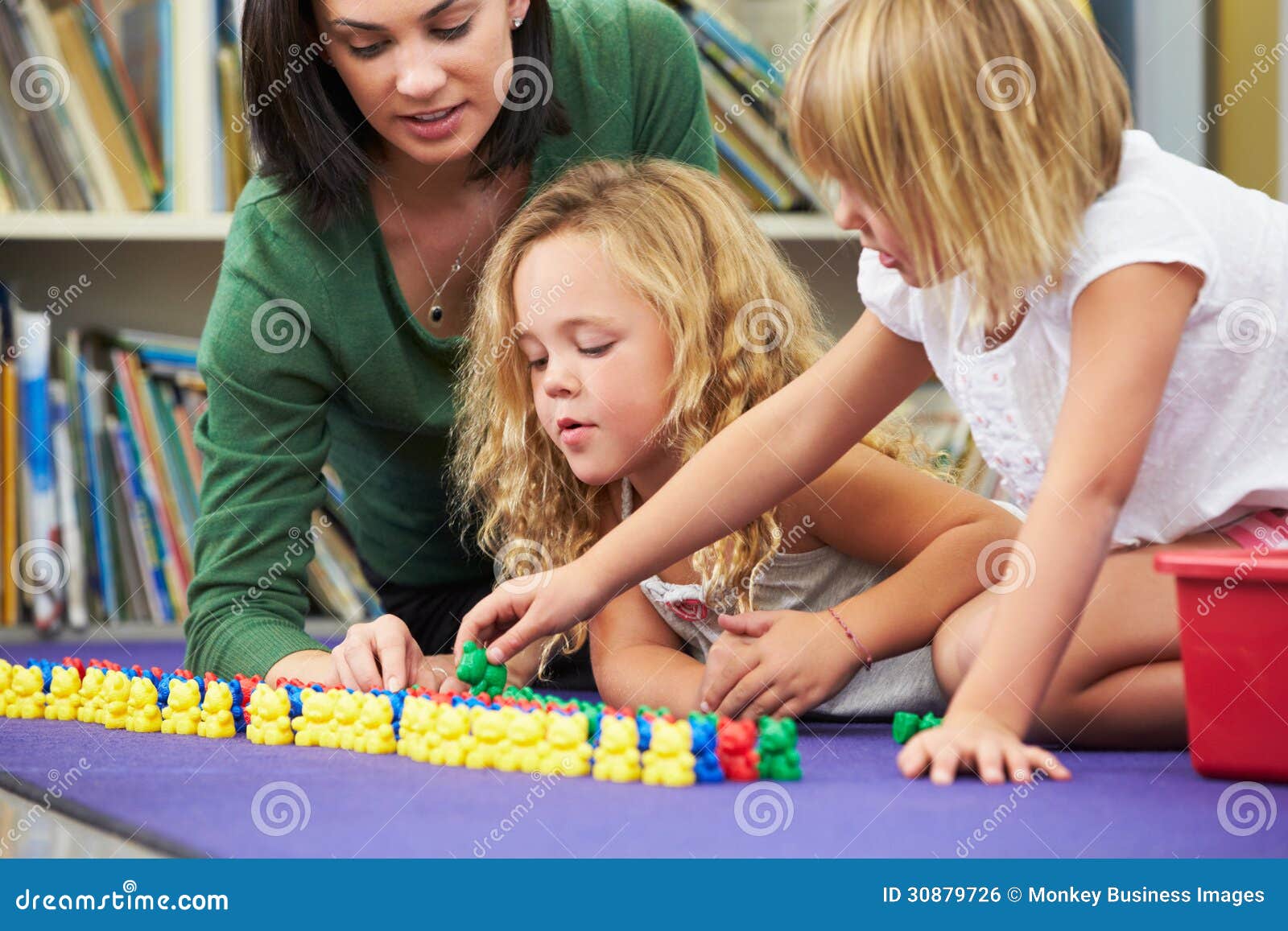 Elementary Pupils Counting with Teacher in Classroom Stock Photo ...