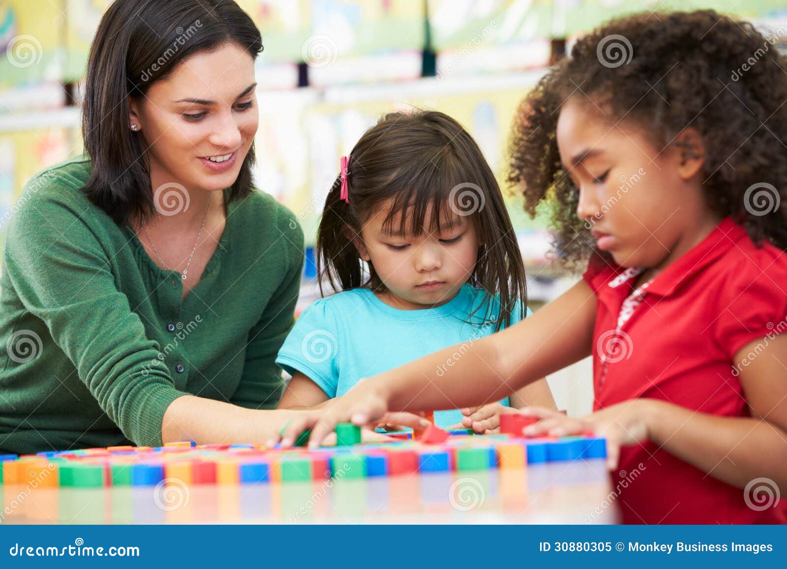 Elementary Pupils Counting With Teacher In Classroom Royalty-Free Stock ...
