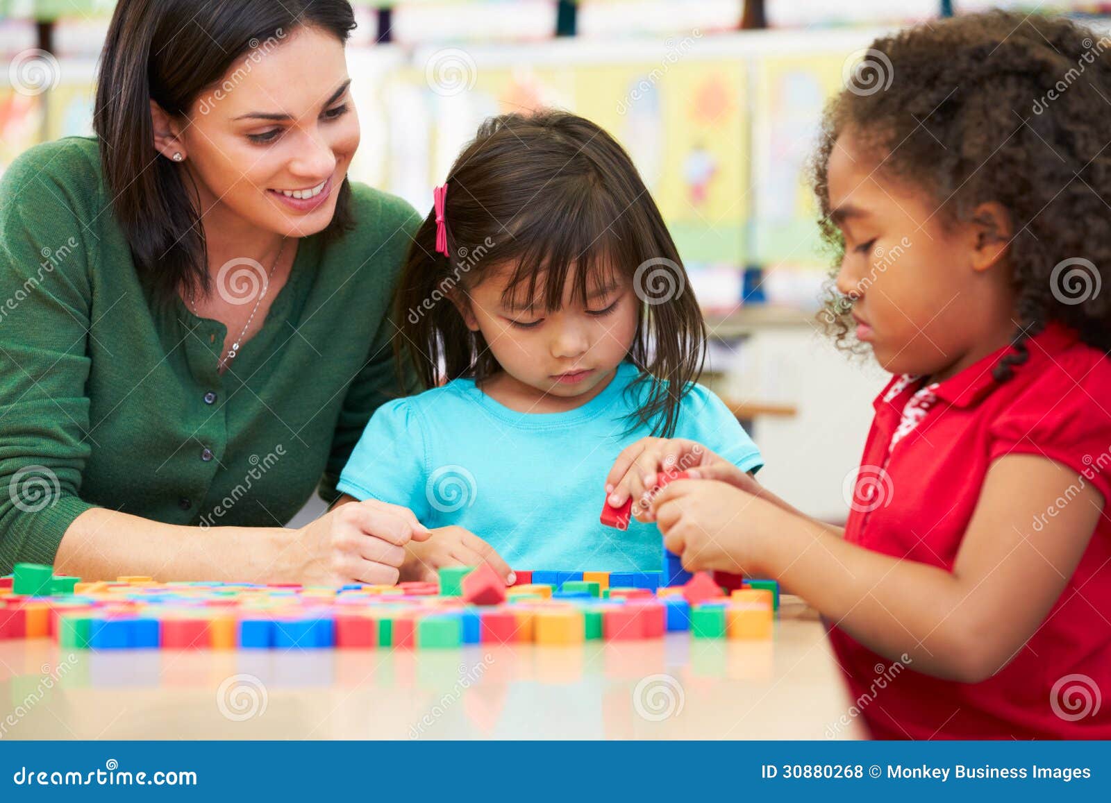 Elementary Pupils Counting with Teacher in Classroom Stock Photo ...