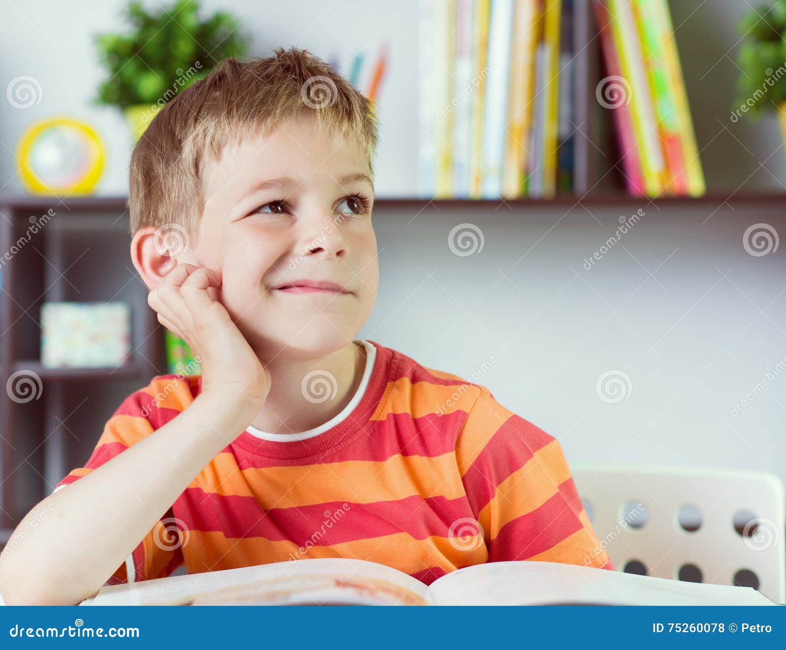 Elementary School Boy at Desk Reading Boock Stock Photo - Image of desk ...