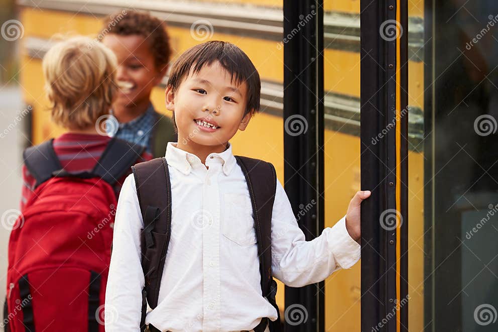Elementary School Boy at the Front of the School Bus Queue Stock Image ...