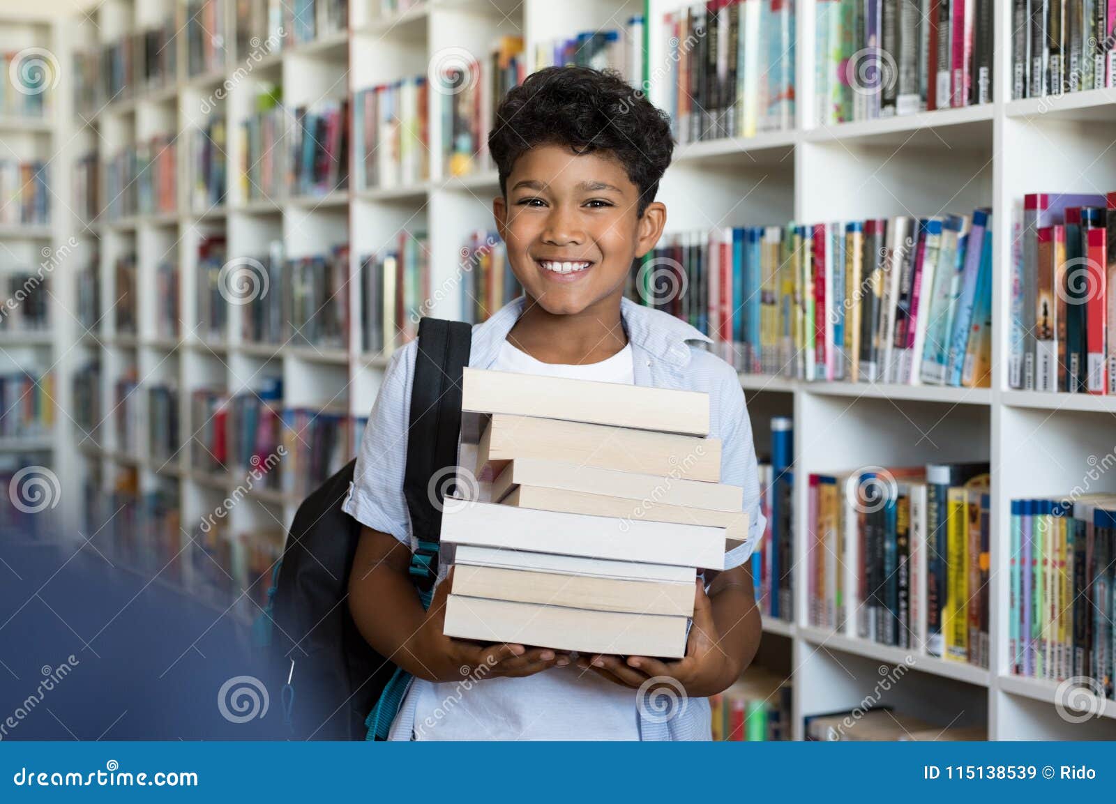 Elementary School Boy Holding Books Stock Image - Image of portrait ...