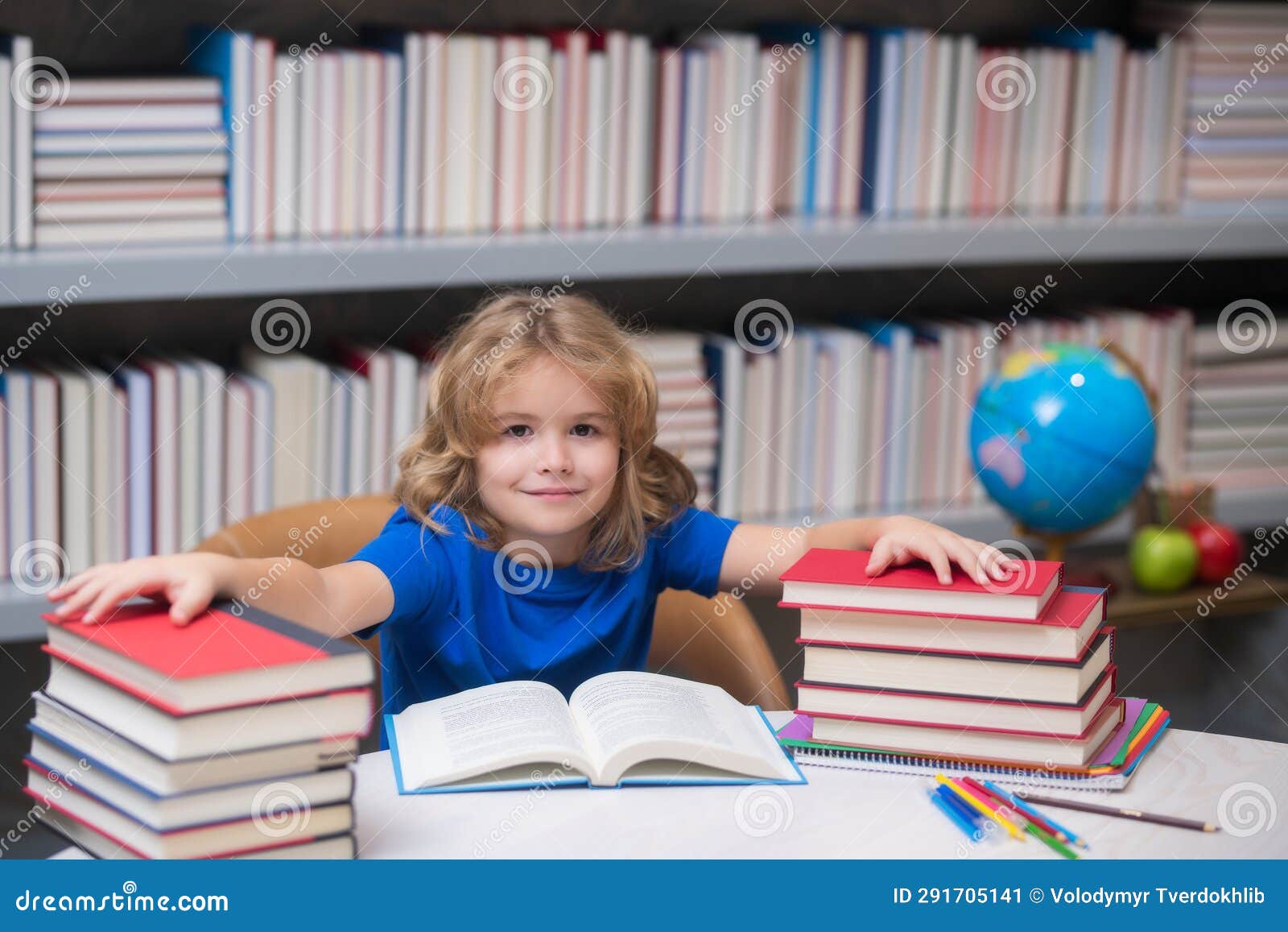 Elementary School Boy. School Boy Reading Book in Library. Kids ...