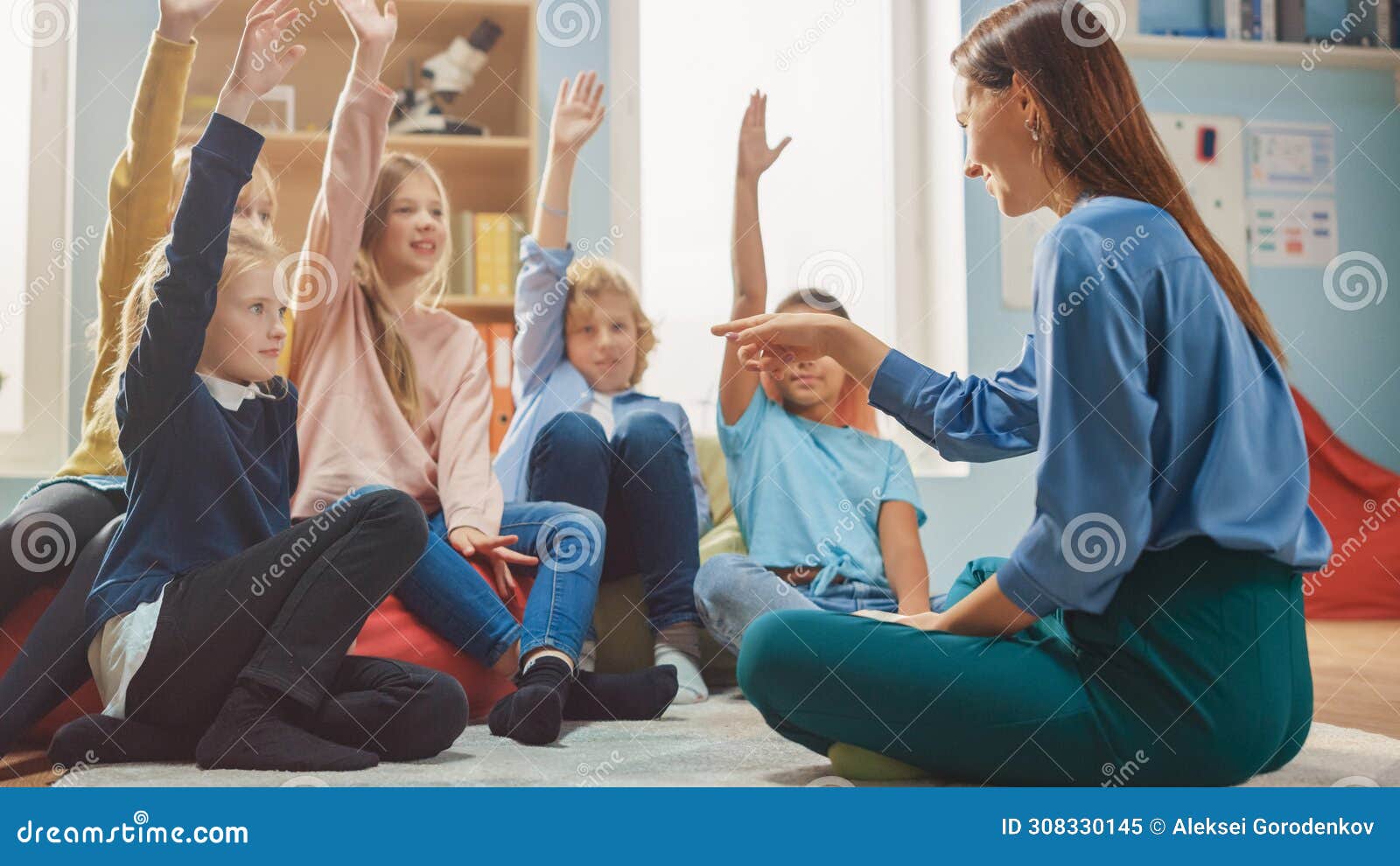 Elementary School Creativity Class: Children Sitting on the Carpet ...