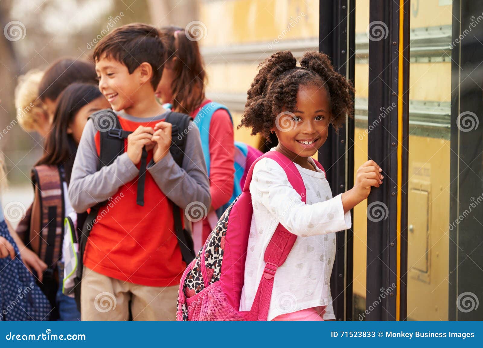 Elementary School Girl at the Front of the School Bus Queue Stock Image ...
