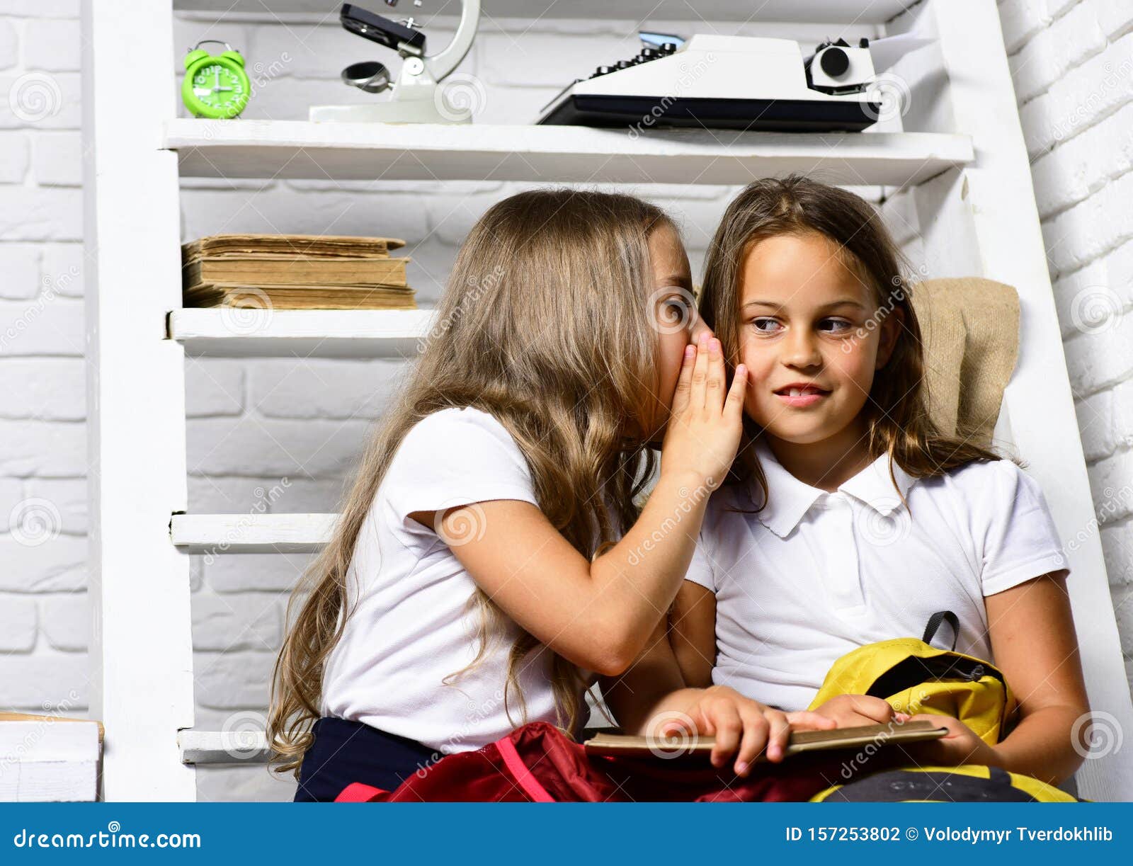Elementary School Girls Reading a Book in Class. Stock Photo - Image of ...