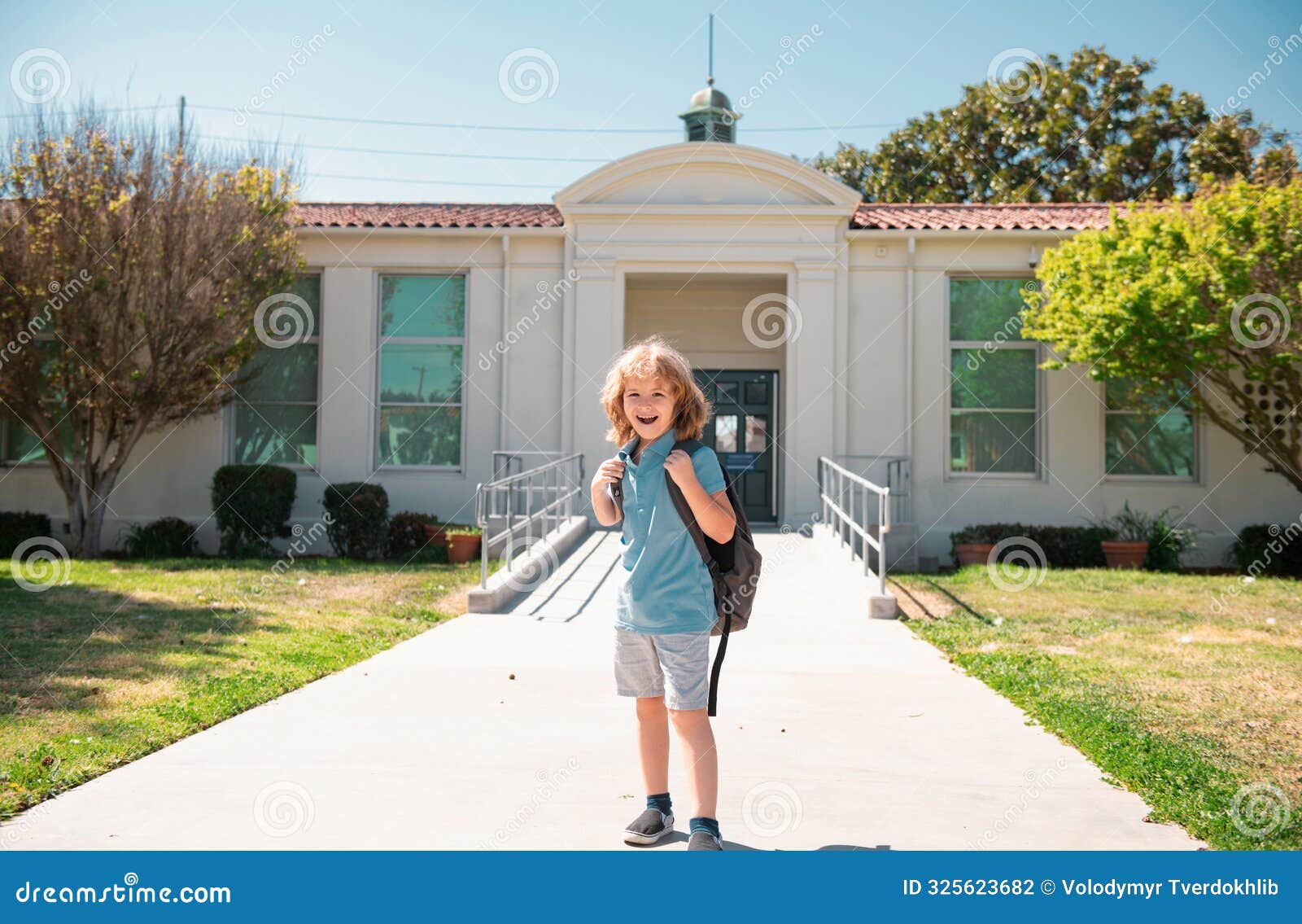 Elementary School Kid Running at the School. Pupil Go Study with ...