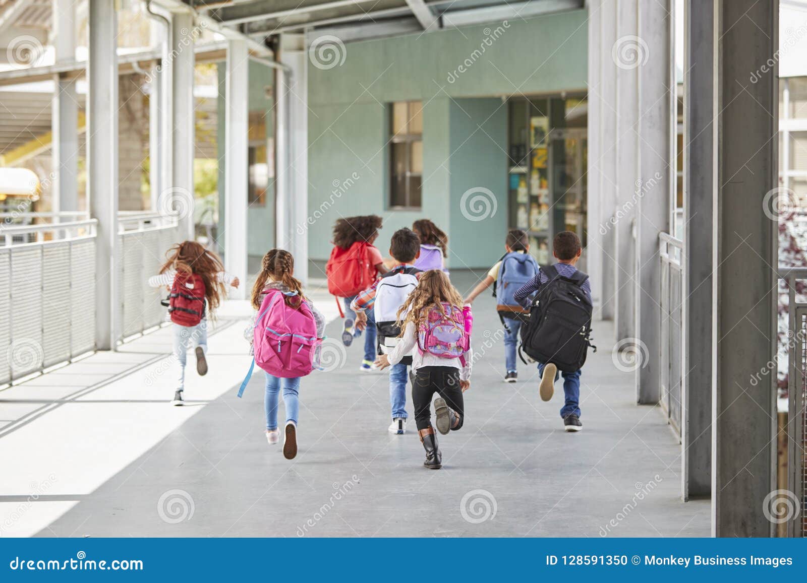 Elementary School Kids Run from Camera in School Corridor Stock Photo ...