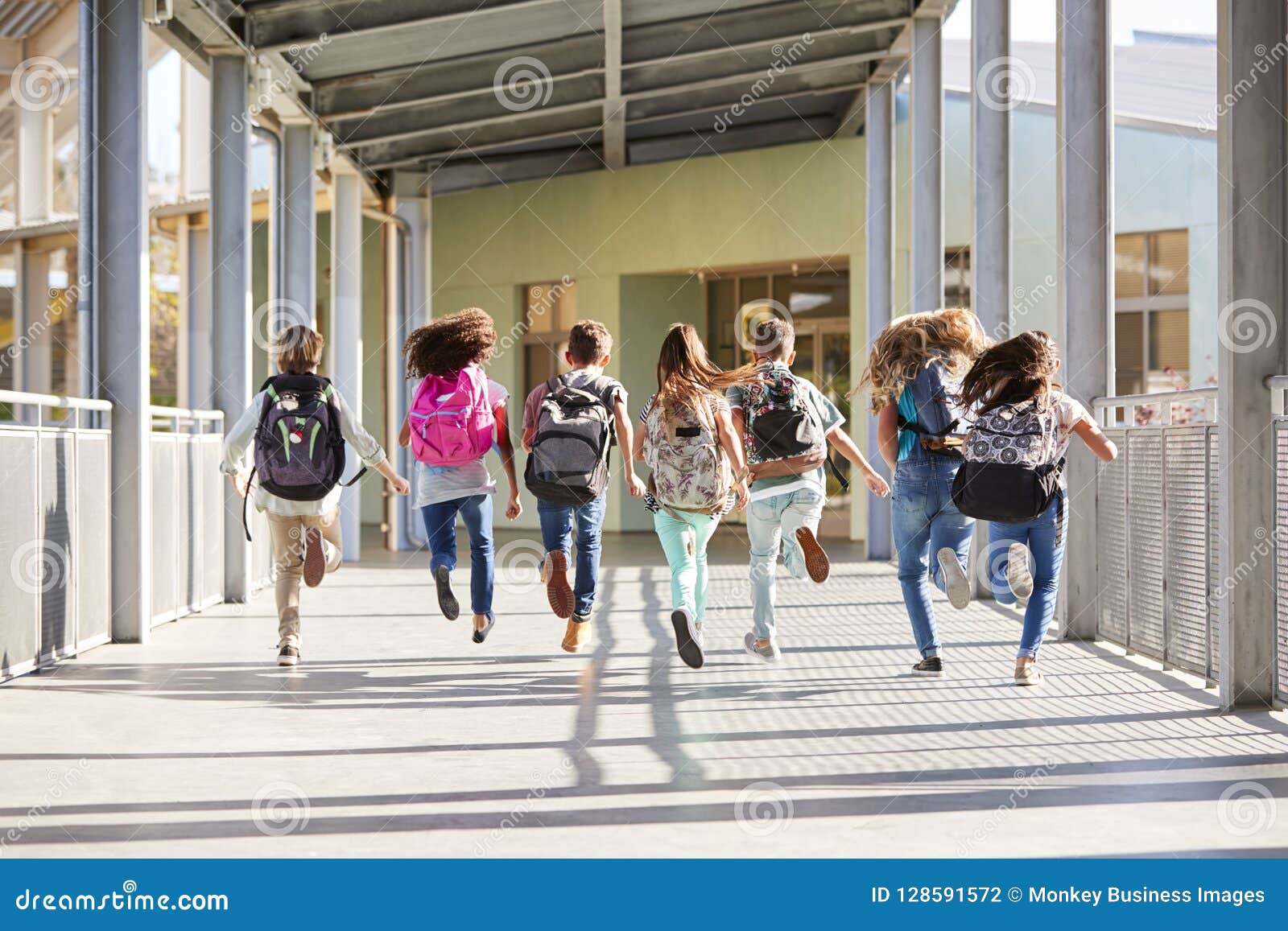 Elementary School Kids Running at School, Back View Close Up Stock ...