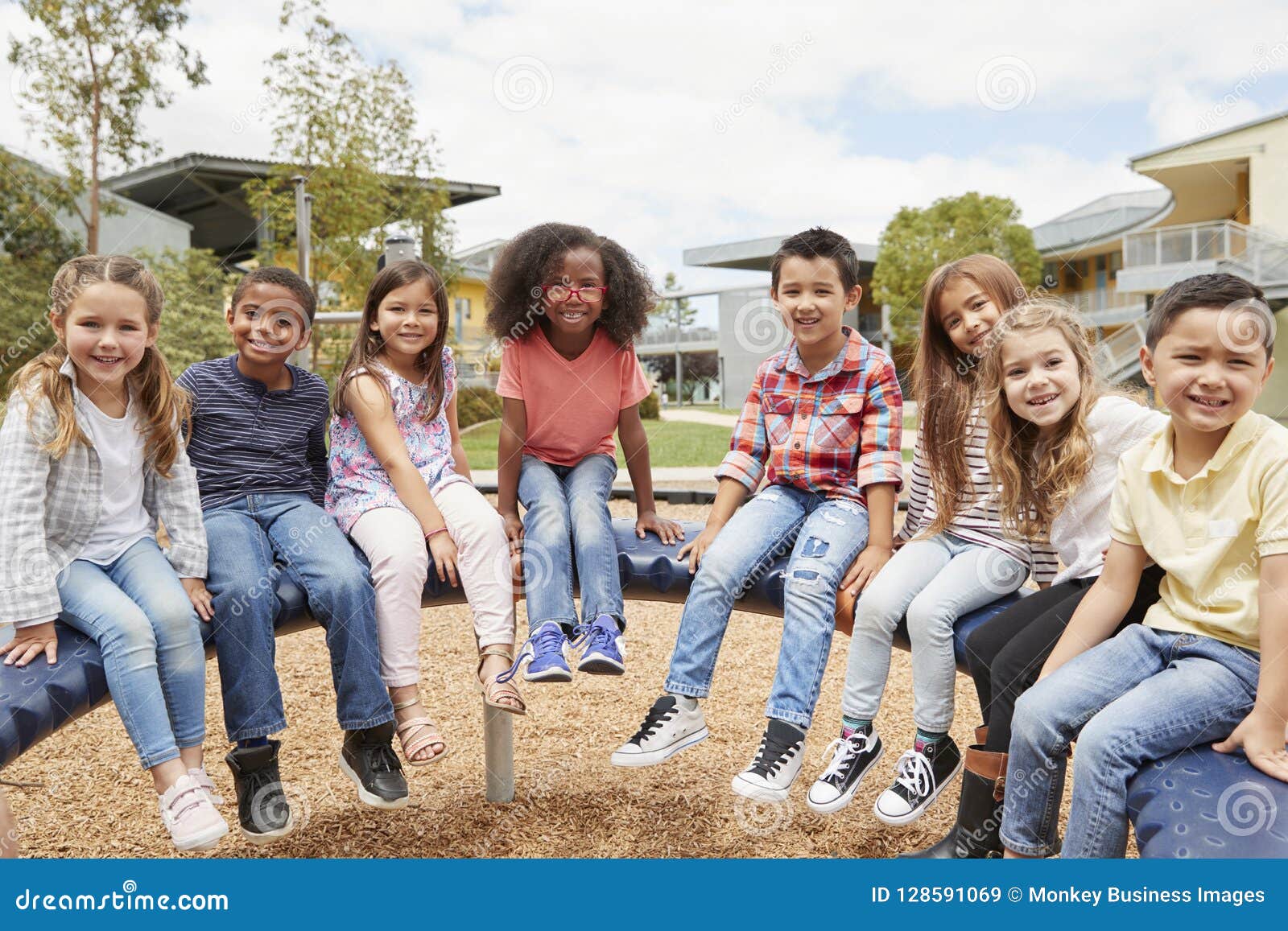 Elementary School Kids Sitting on Carousel in the Schoolyard Stock ...