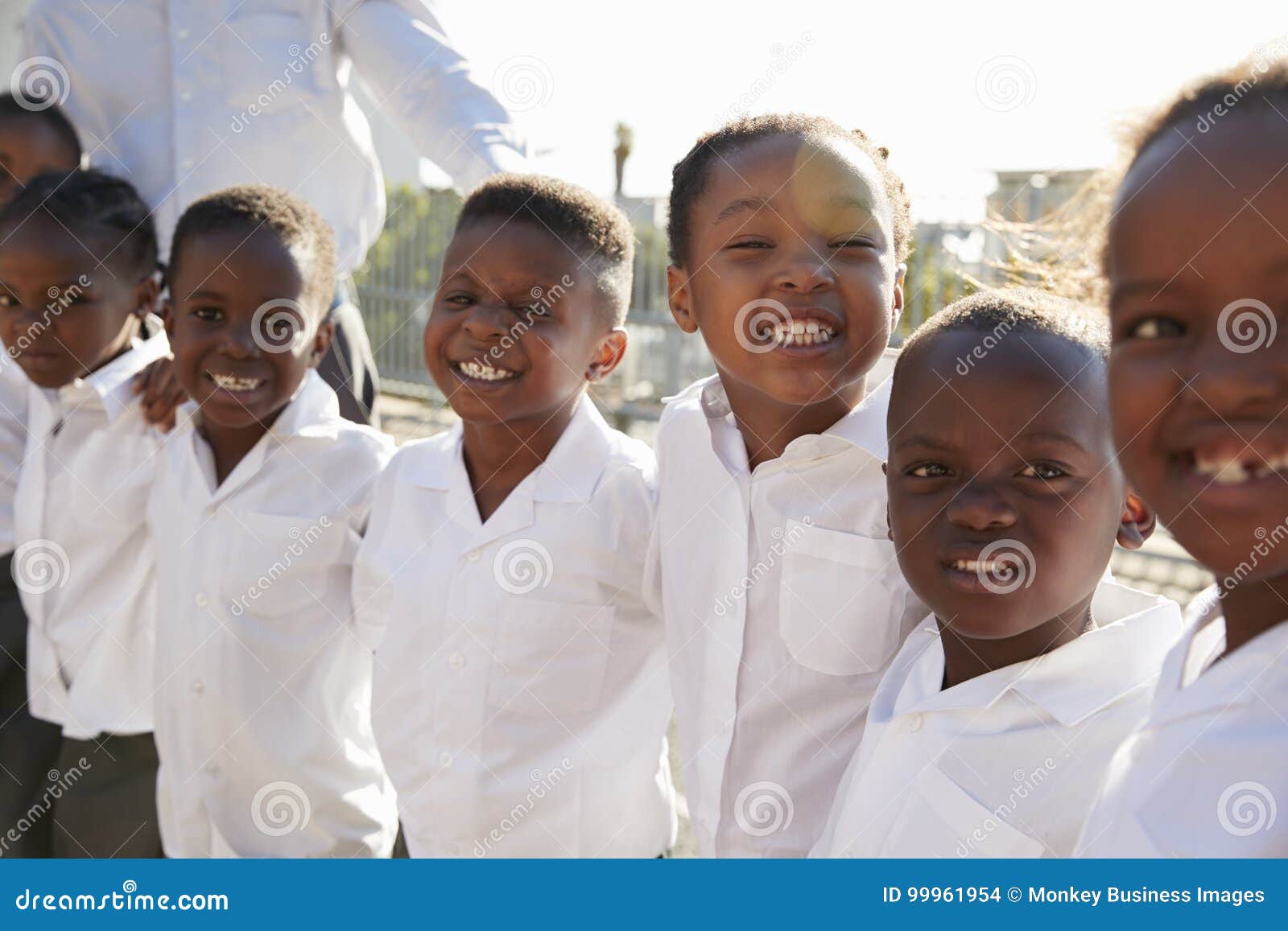 Elementary School Kids Smiling To Camera in Playground Stock Photo ...