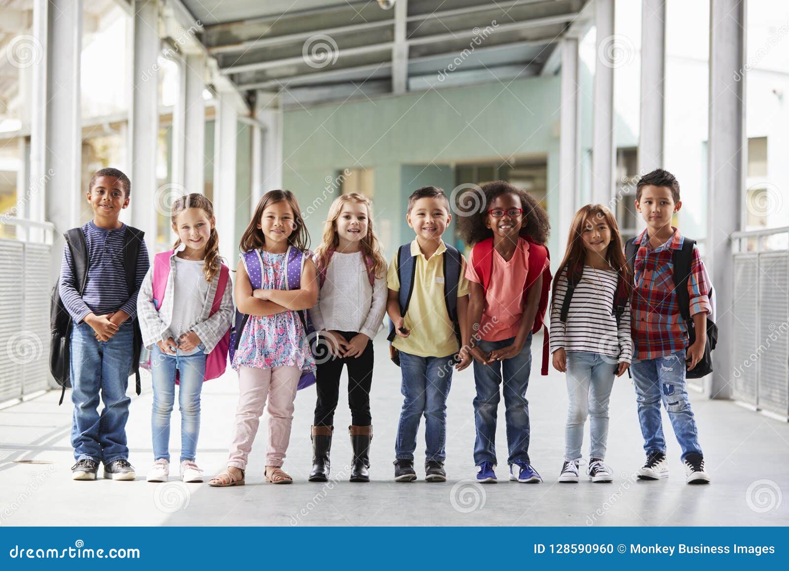Elementary School Kids Stand in Corridor Looking at Camera Stock Photo ...