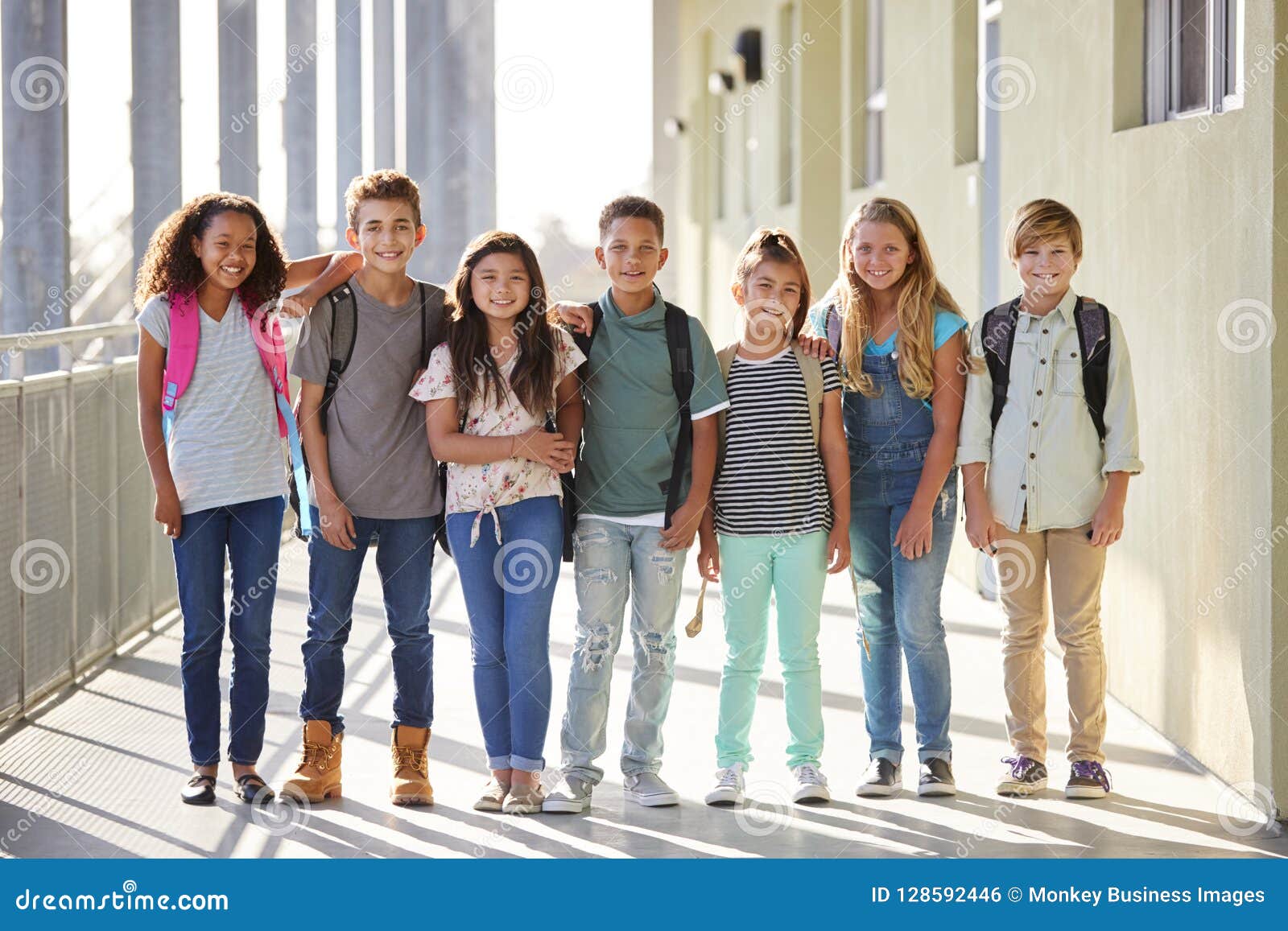 Elementary School Kids Stand in Corridor Looking at Camera Stock Photo ...