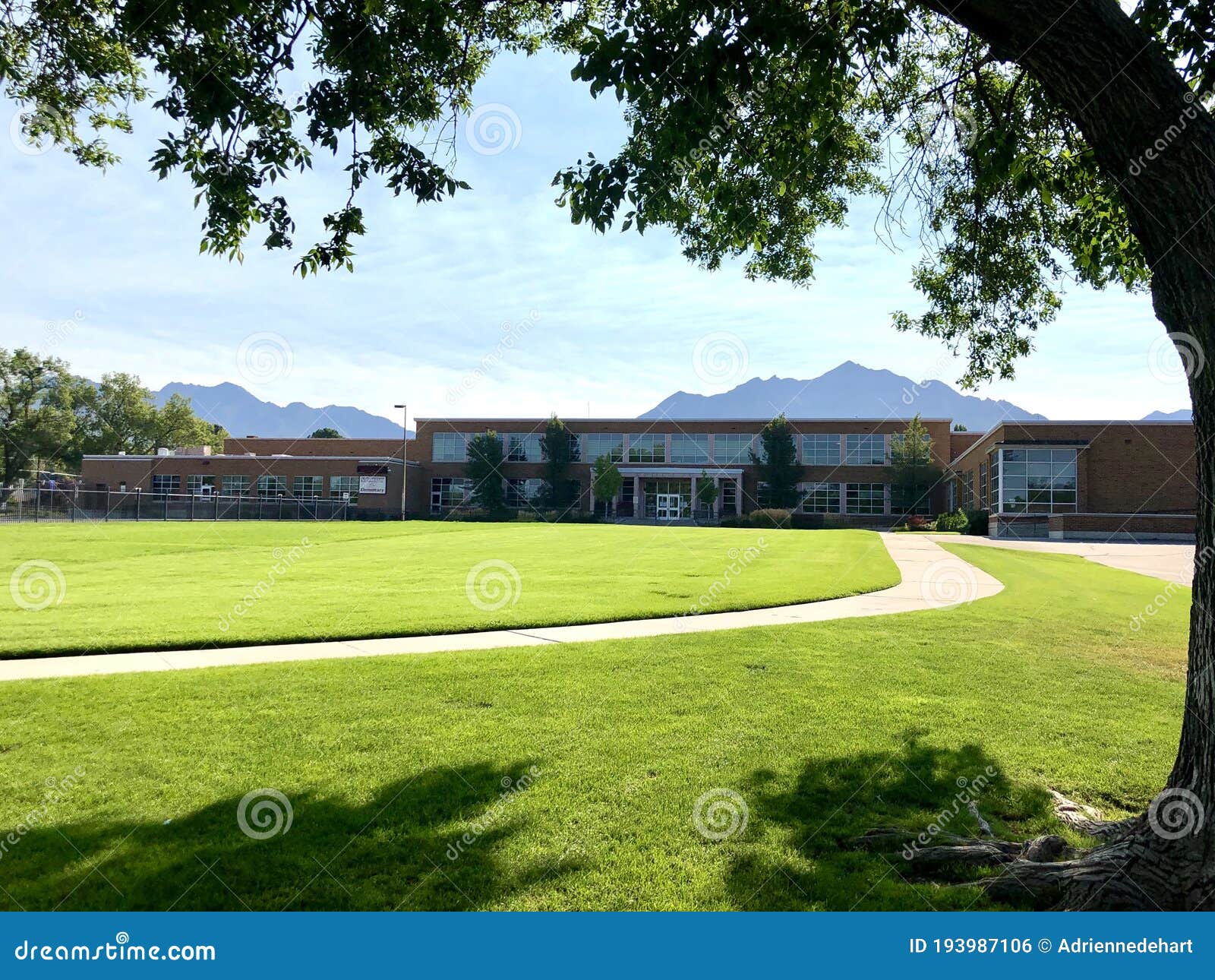 An Elementary School with a Large Grassy Field Stock Photo - Image of ...