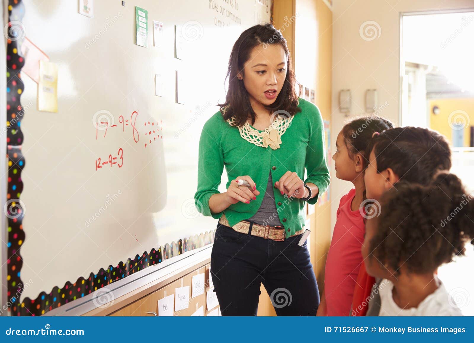 Elementary School Maths Class at the Whiteboard with Teacher Stock ...