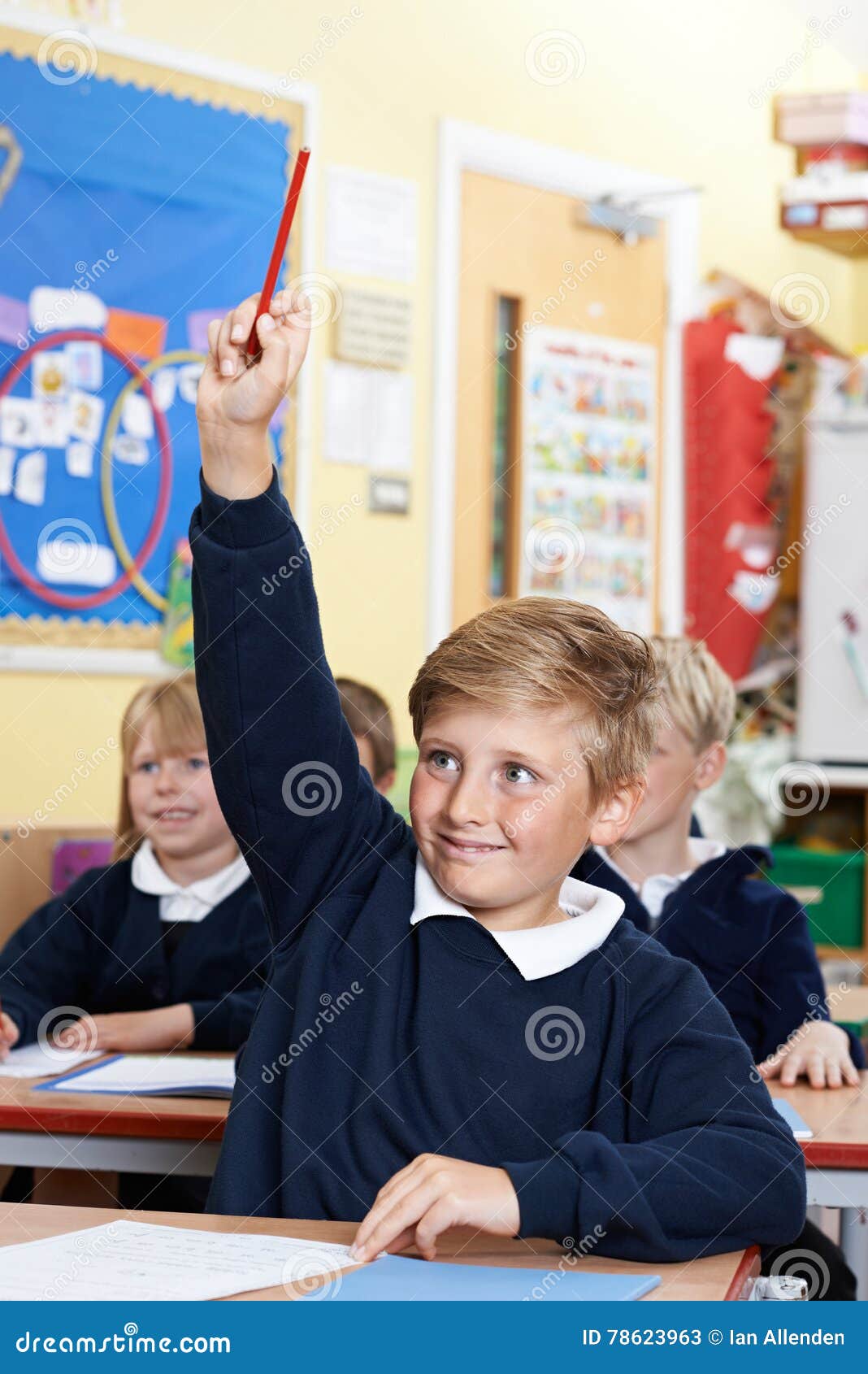 Elementary School Pupil Answering Question in Class Stock Image - Image ...