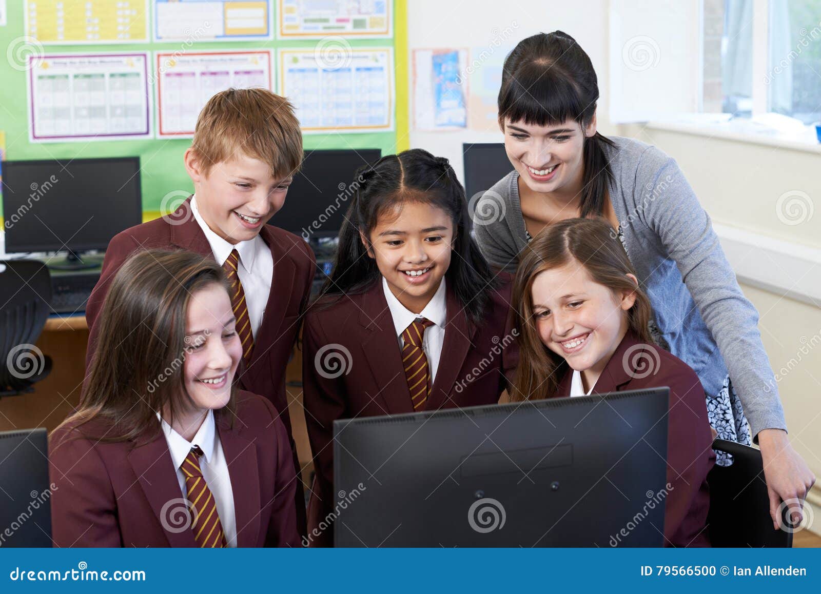 Elementary School Pupils with Teacher in Computer Class Stock Photo ...