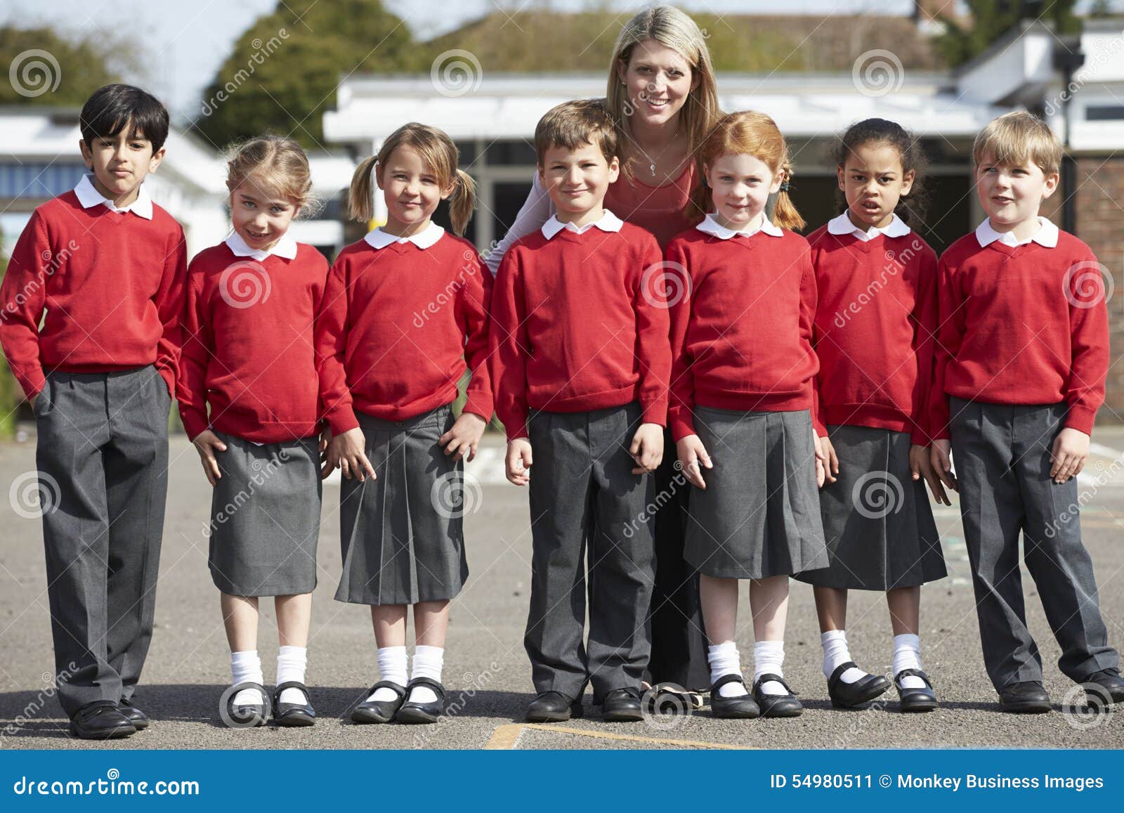 Elementary School Pupils with Teacher in Playground Stock Image - Image ...