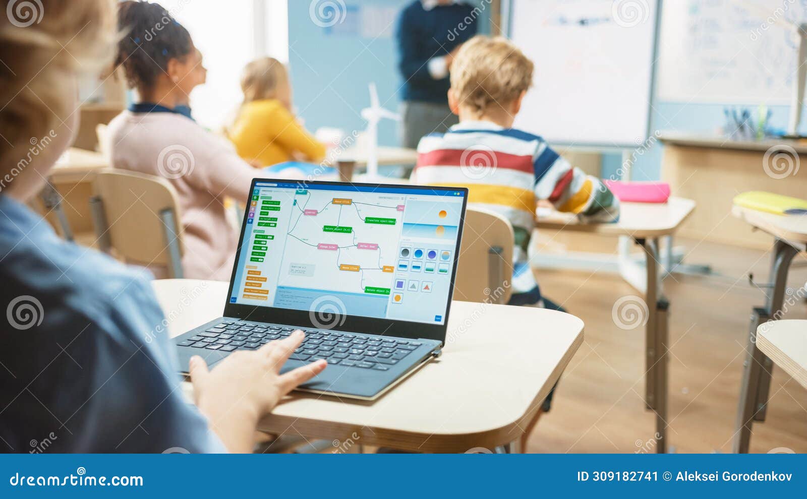 Elementary School Science Class: Over the Shoulder Little Boy Uses ...