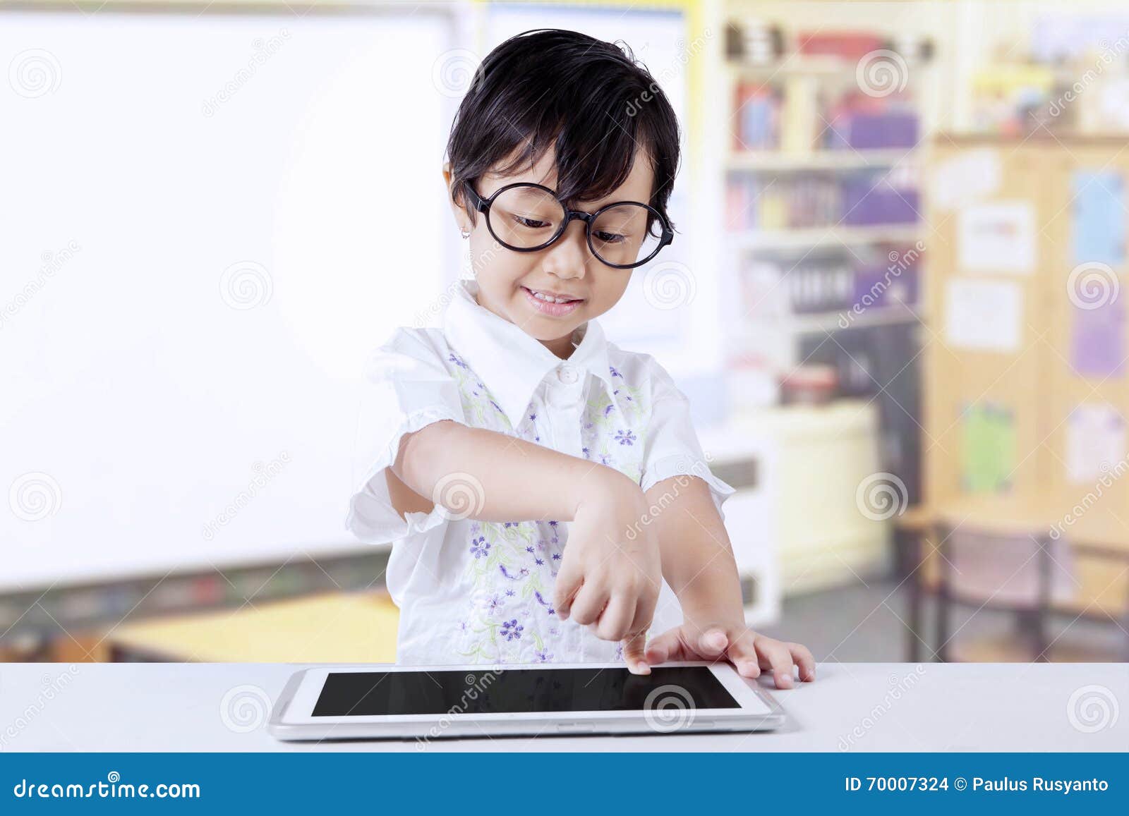 Elementary School Student Uses Tablet in Class Stock Photo - Image of ...