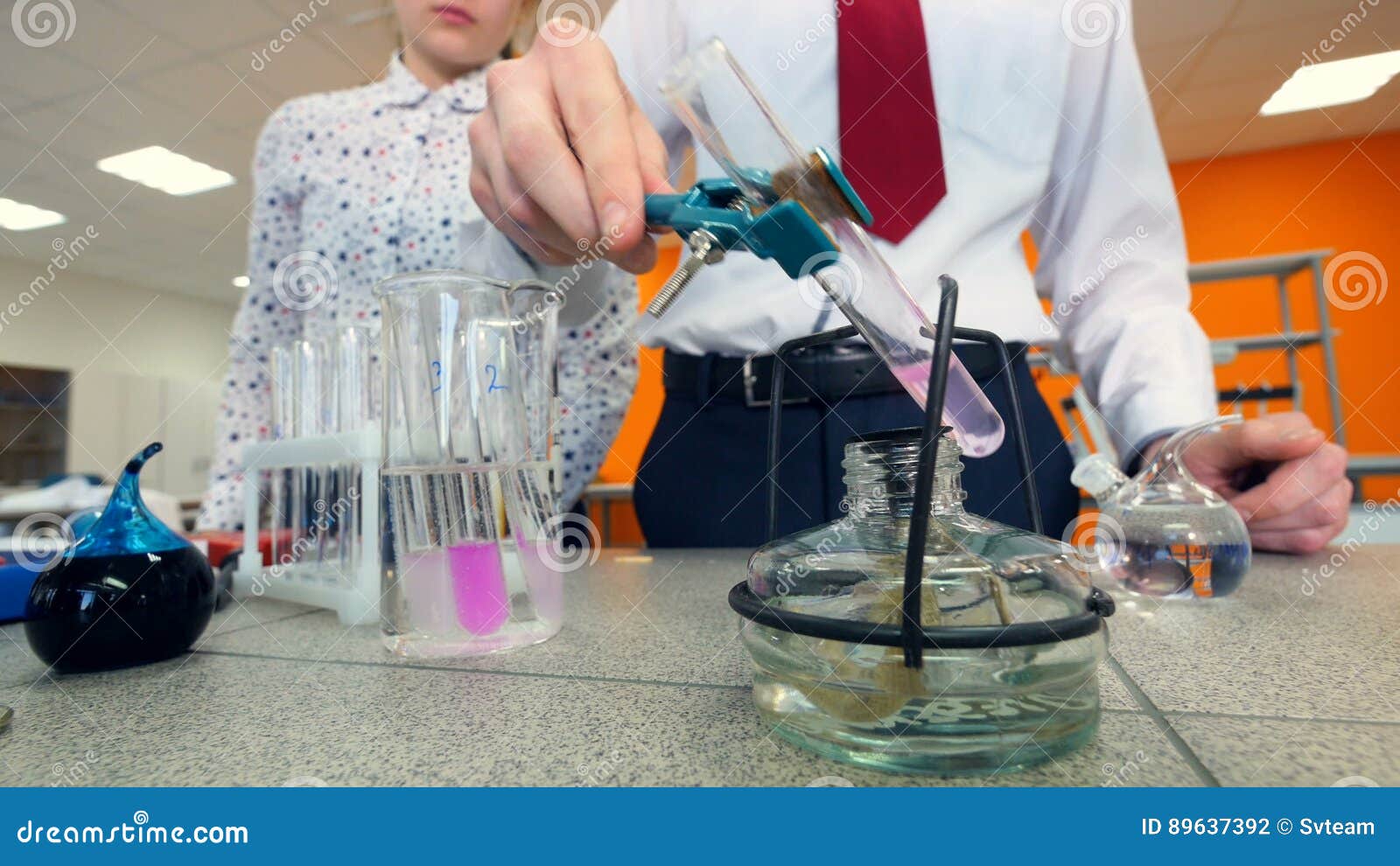 Elementary School Students Heating a Test Tube Doing Chemistry ...