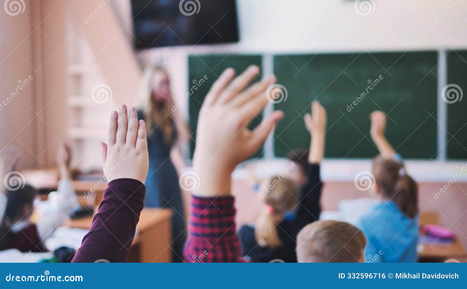Elementary School Students Raise Their Hands during Class. Stock Photo ...