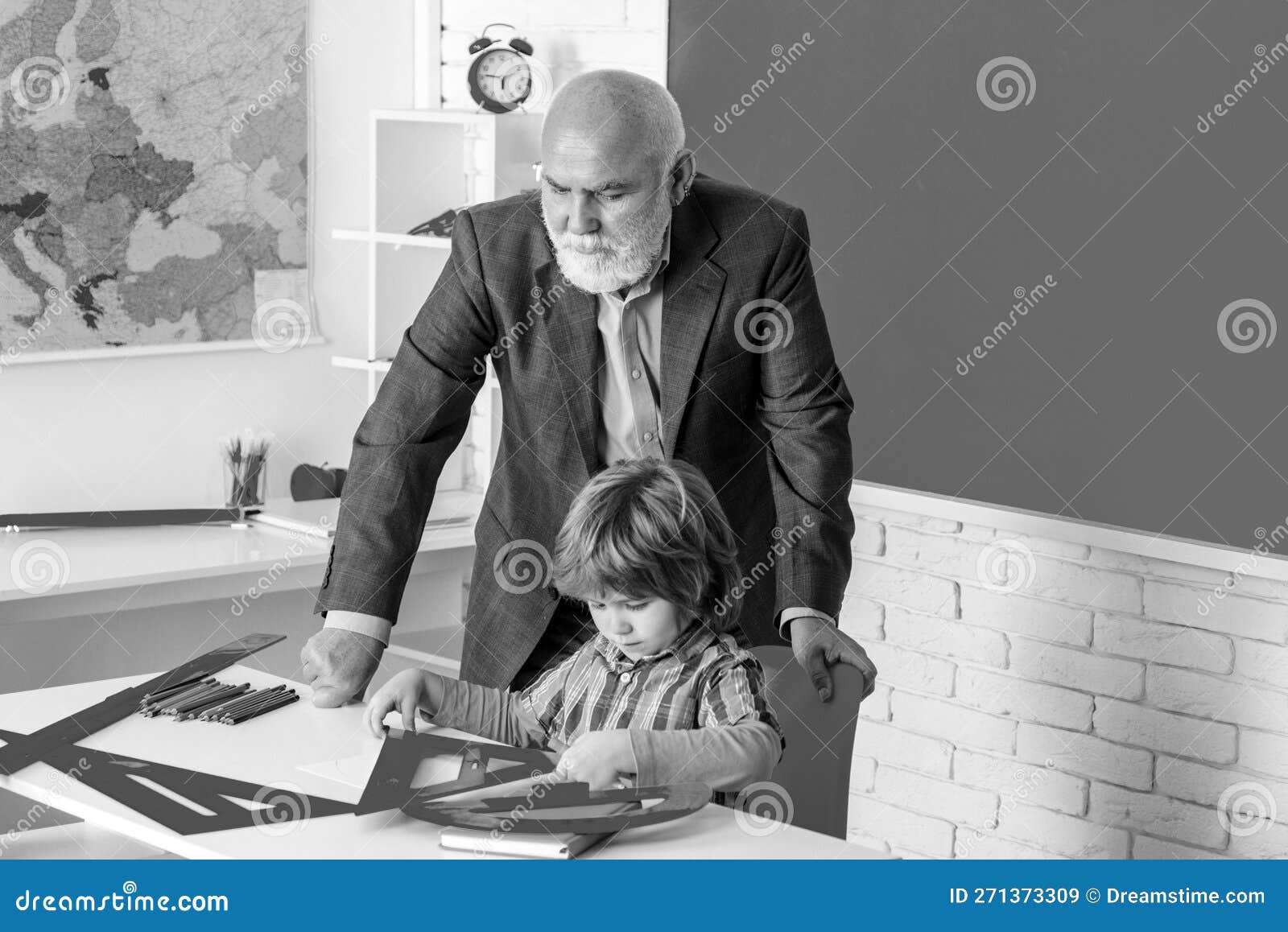 Elementary School. Elementary School Teacher Giving Female Pupil ...