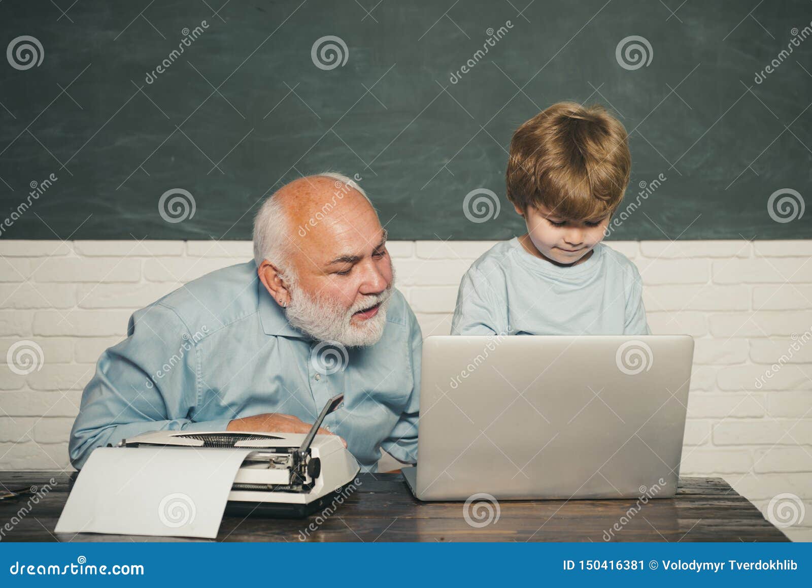 Elementary School Teacher and Student in Classroom. Teacher and ...