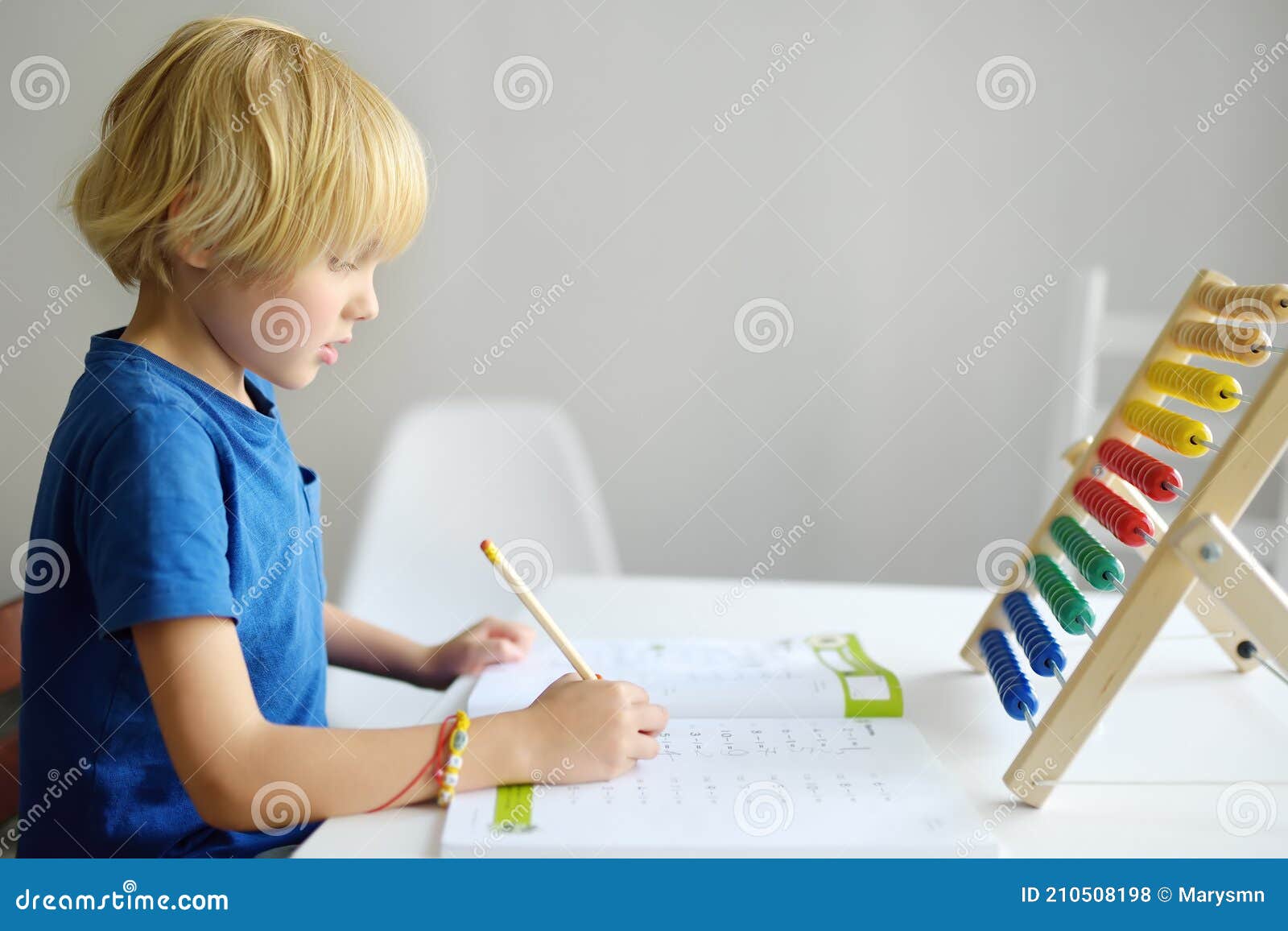 Elementary Student Boy Doing Homework at Home. Child Learning To Count ...