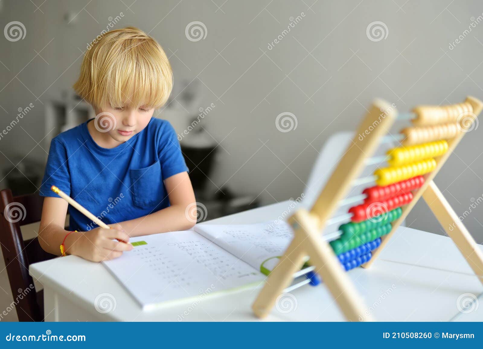 Elementary Student Boy Doing Homework at Home. Child Learning To Count ...