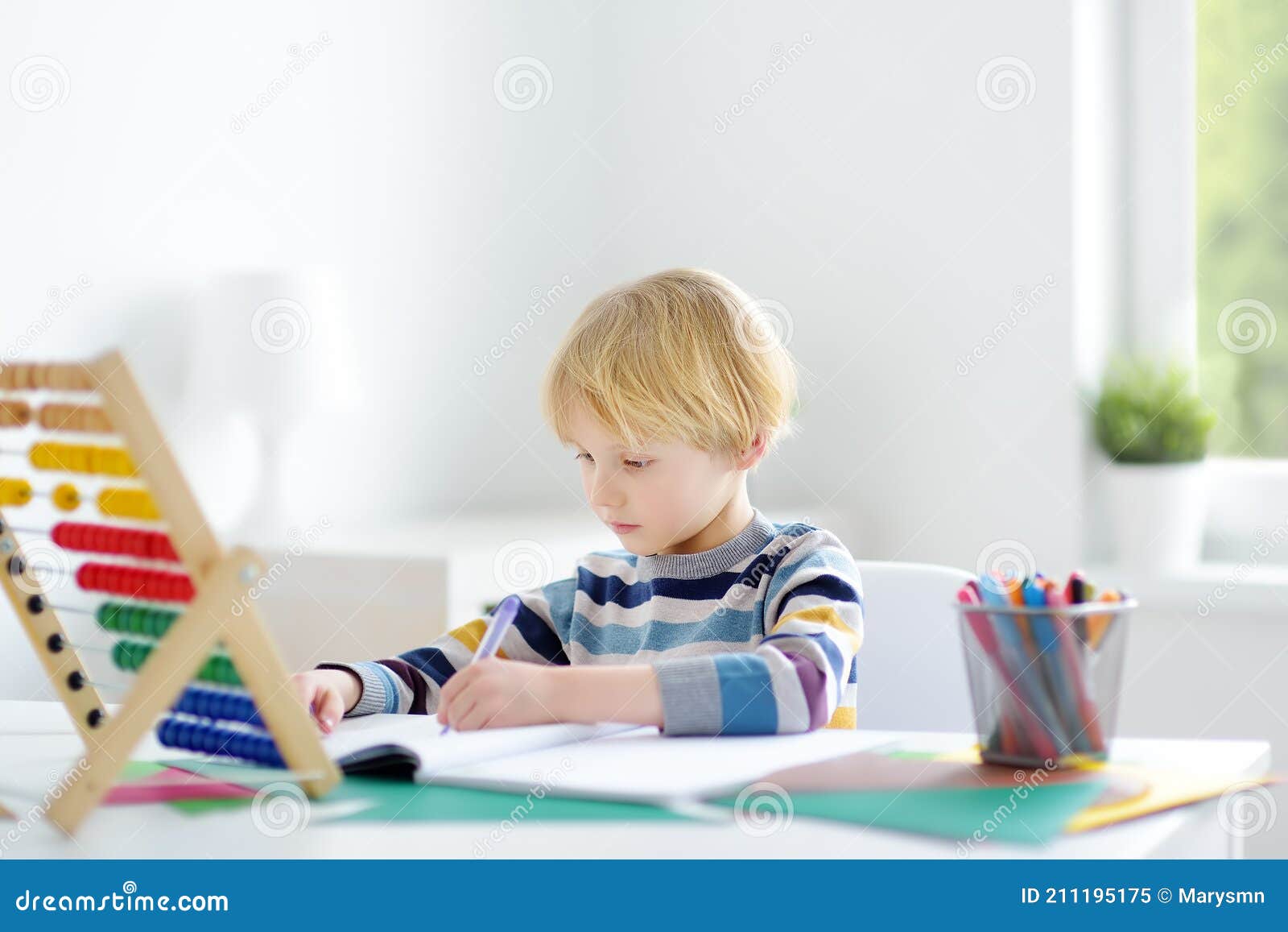 Elementary Student Boy Doing Homework at Home. Child Learning To Count ...