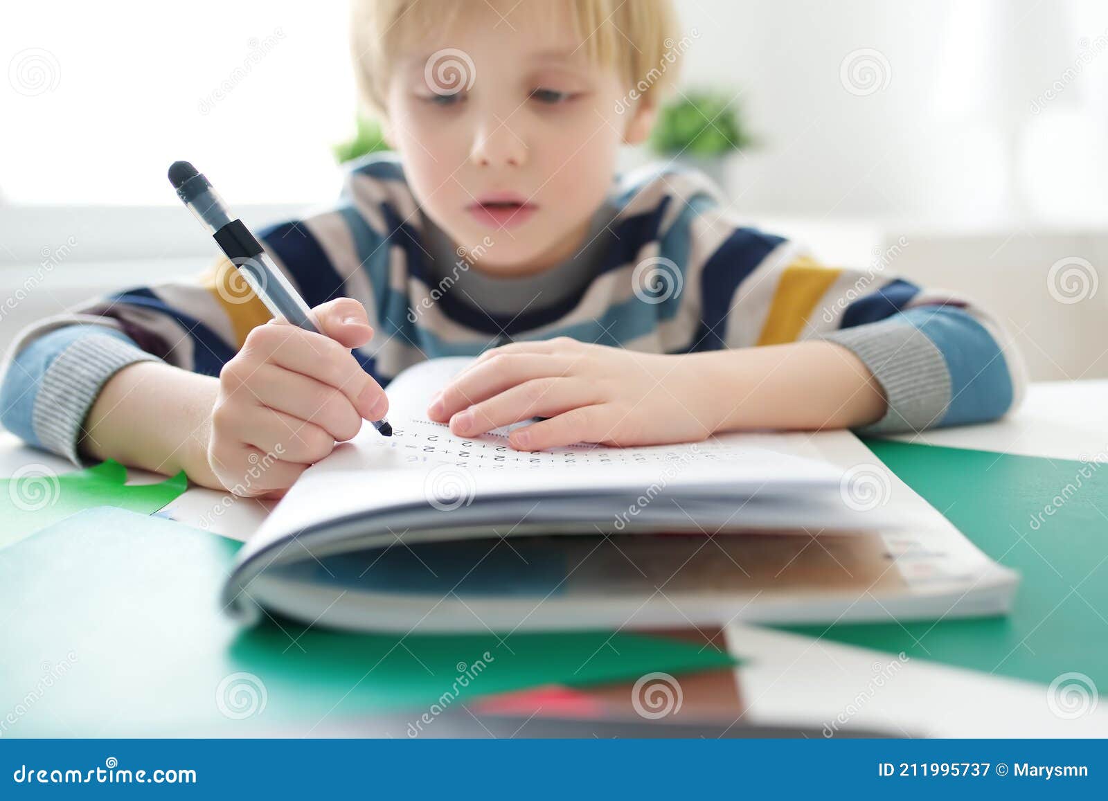 Elementary Student Boy Doing Homework at Home. Child Learning To Count ...