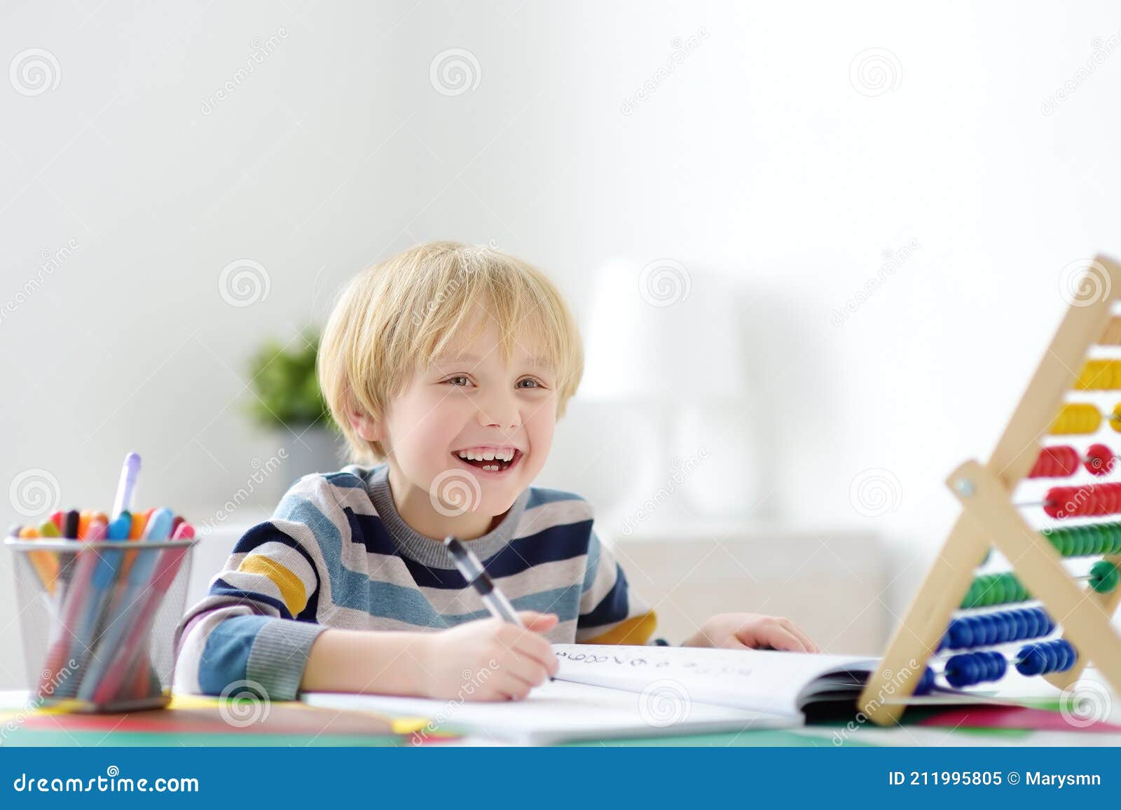 Elementary Student Boy Doing Homework at Home. Child Learning To Count ...