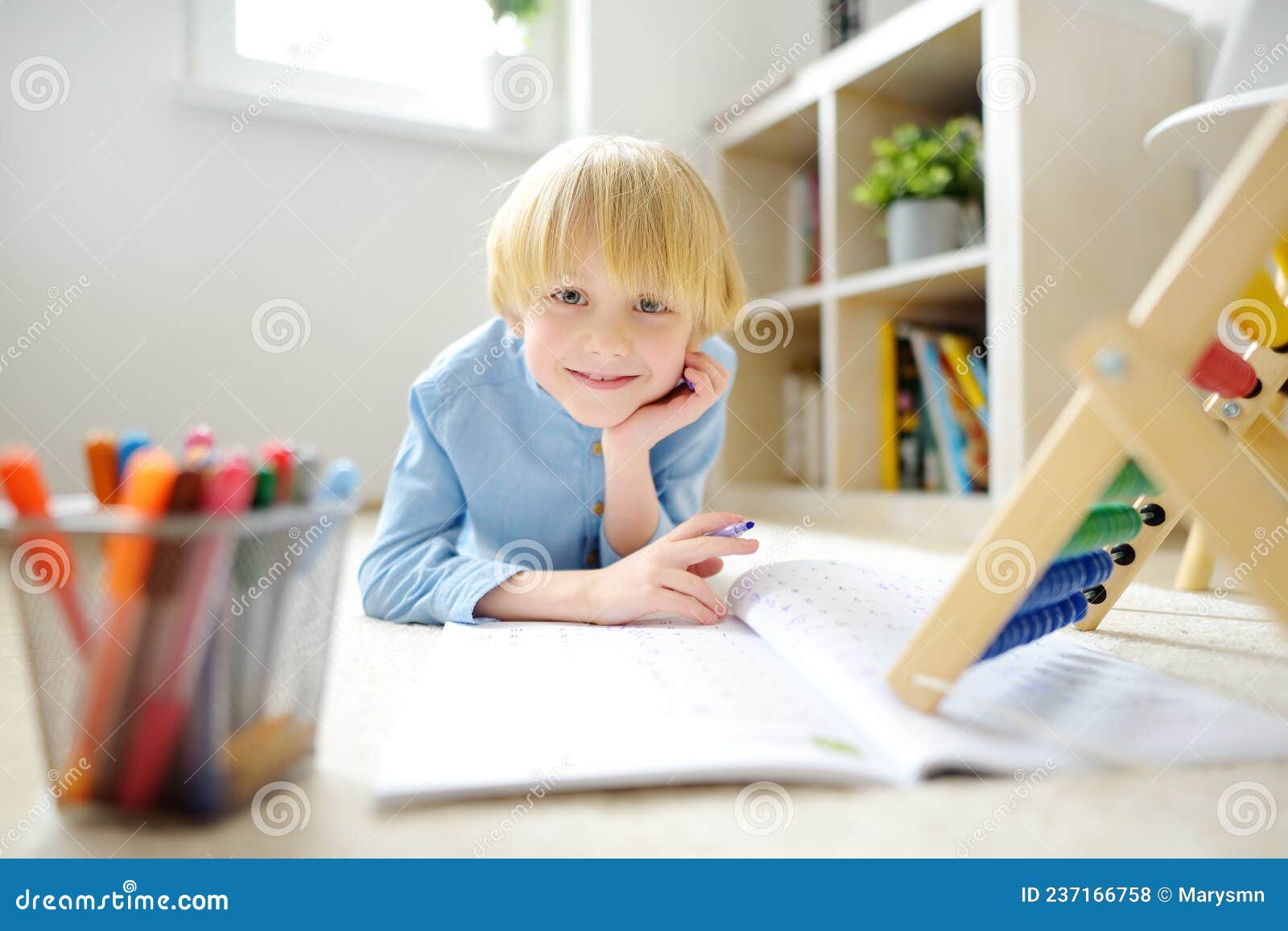Elementary Student Boy Doing Homework at Home. Child Learning To Count ...