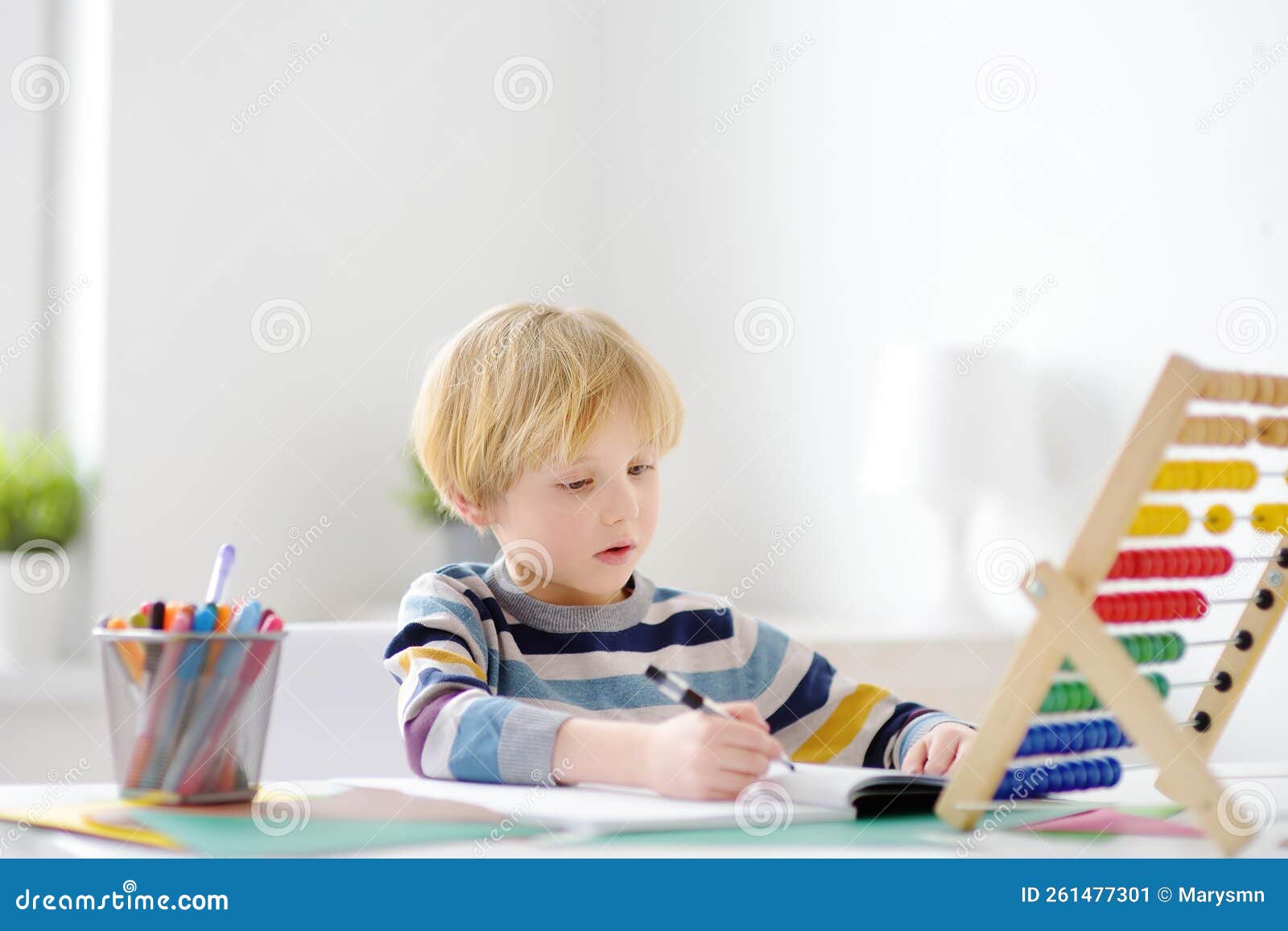 Elementary Student Boy Doing Homework at Home. Child Learning To Count ...