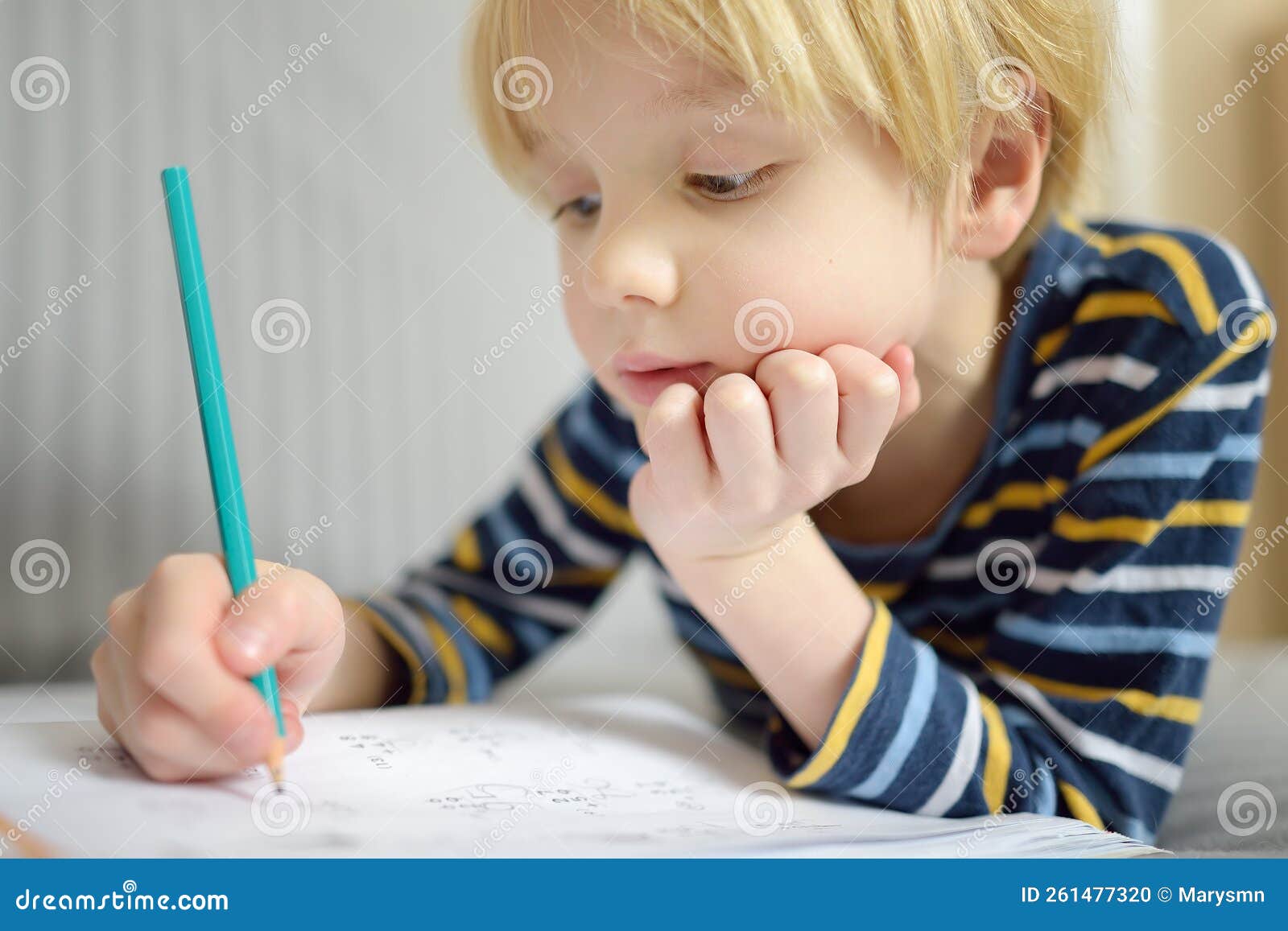 Elementary Student Boy Doing Homework at Home. Child Learning To Count ...