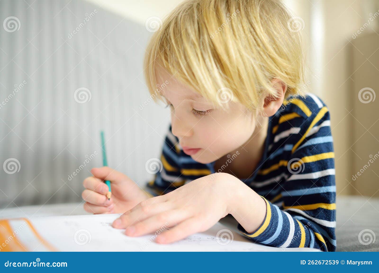 Elementary Student Boy Doing Homework at Home. Child Learning To Count ...