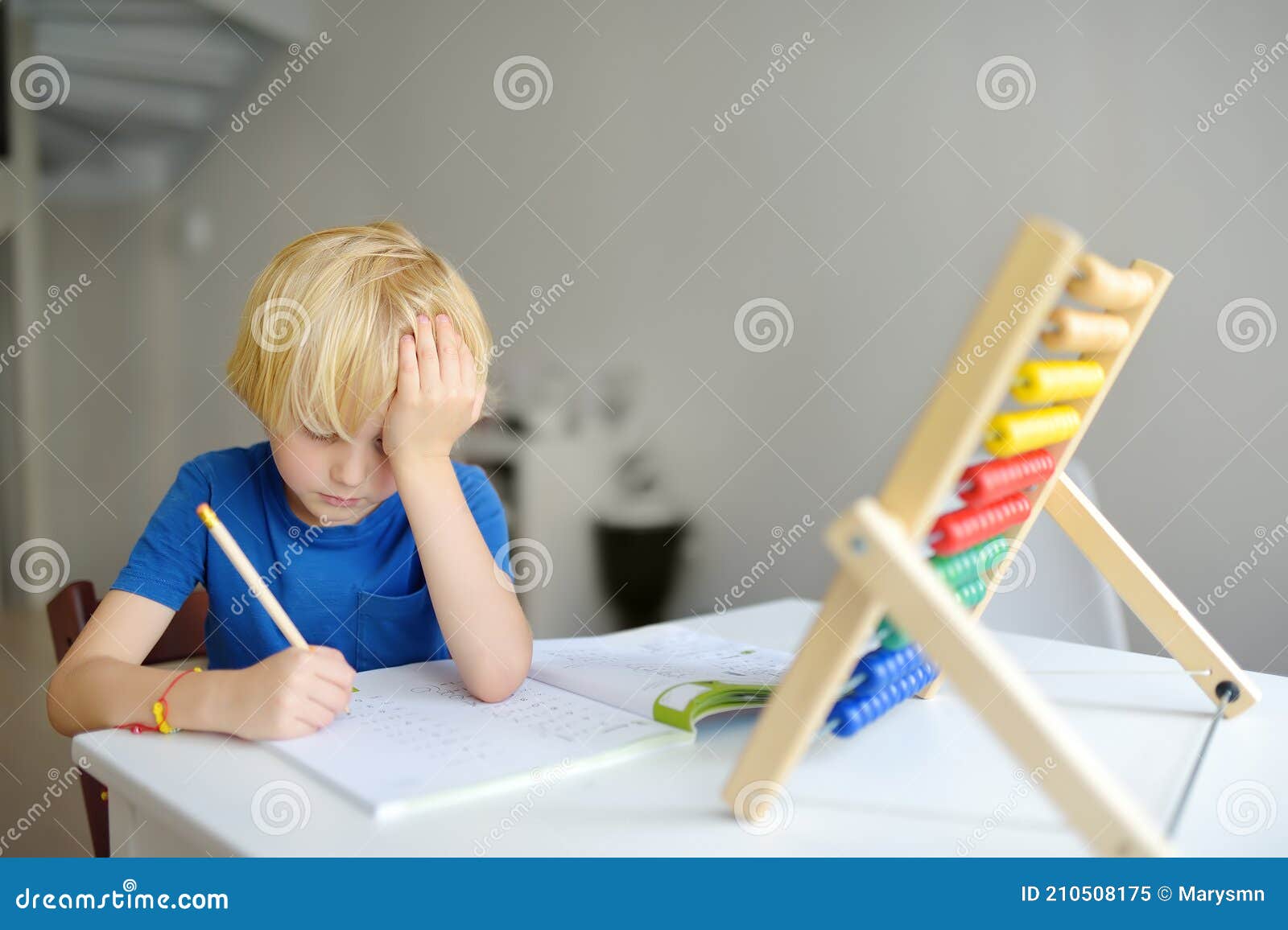 Elementary Student Boy Doing Homework at Home. Child Learning To Count ...