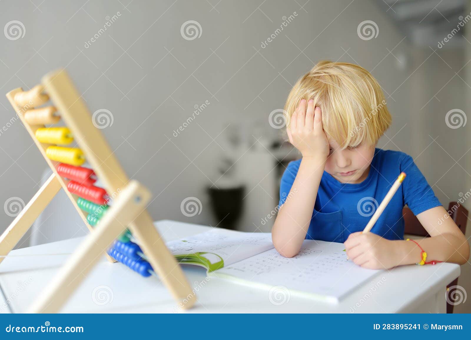 Elementary Student Boy Doing Homework at Home. Child Learning To Count ...
