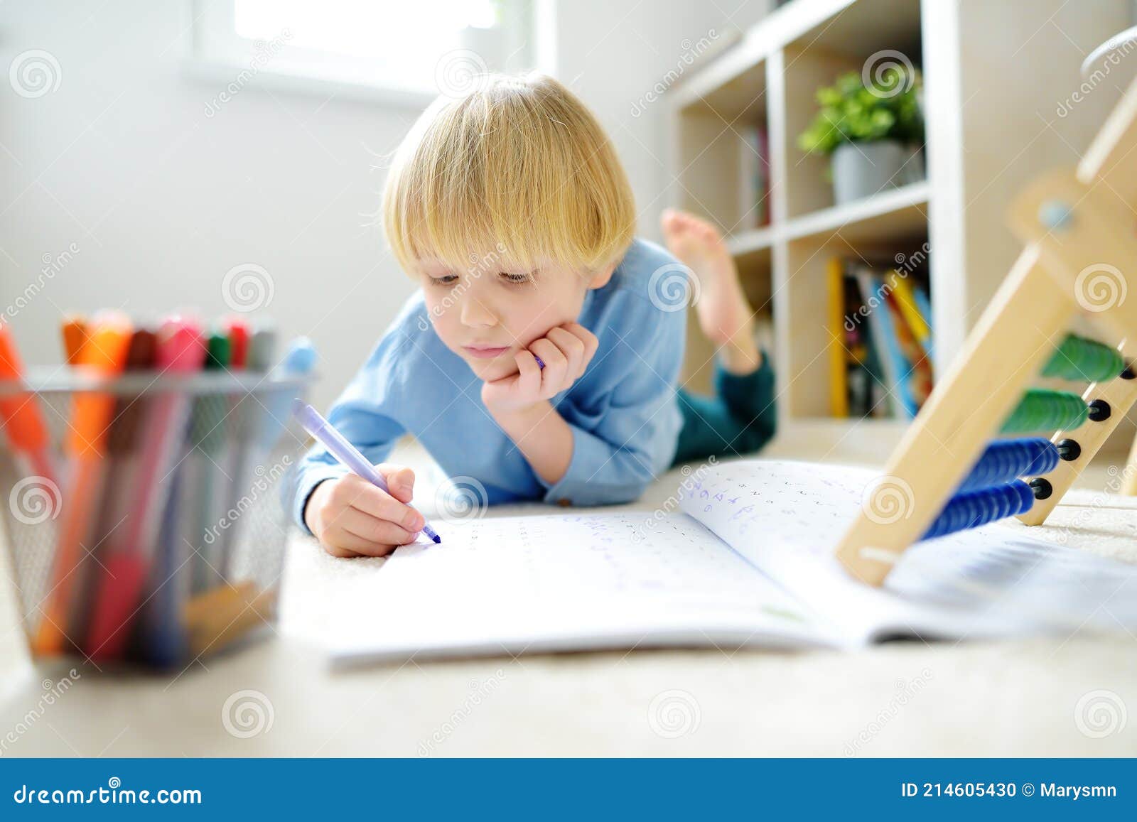 Elementary Student Boy Doing Homework at Home. Child Learning To Count ...