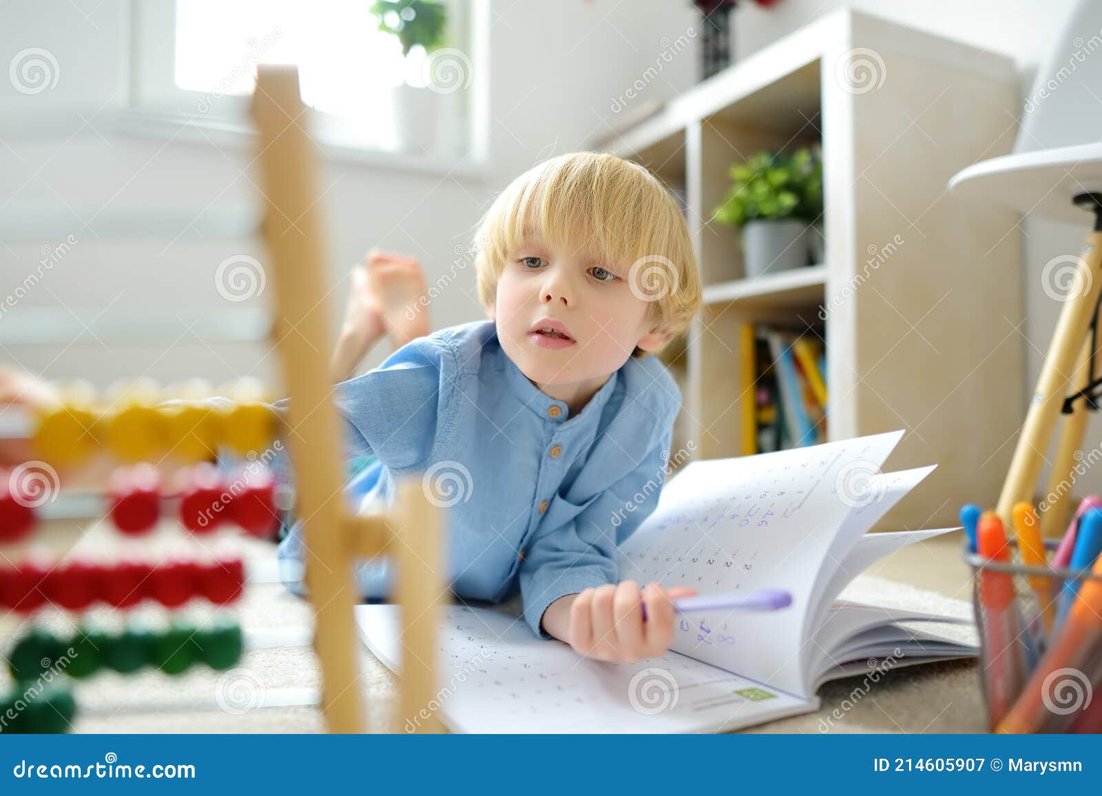Elementary Student Boy Doing Homework at Home. Child Learning To Count ...