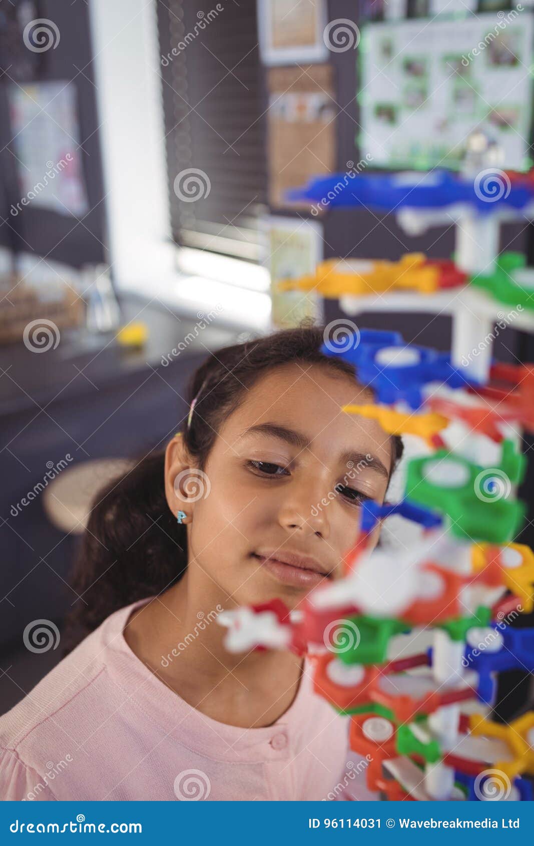 Elementary Student Looking at Model in Classroom Stock Image - Image of ...