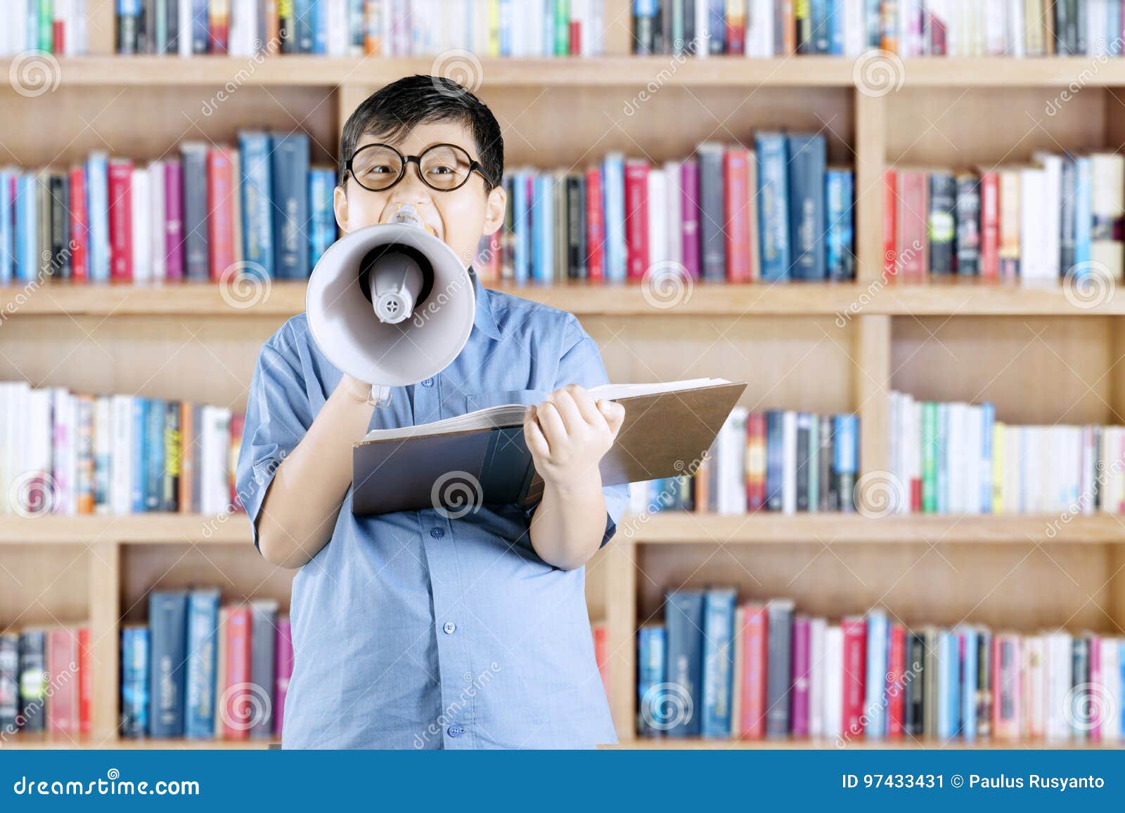 Elementary Student Shouting on Megaphone in Library Stock Image - Image ...