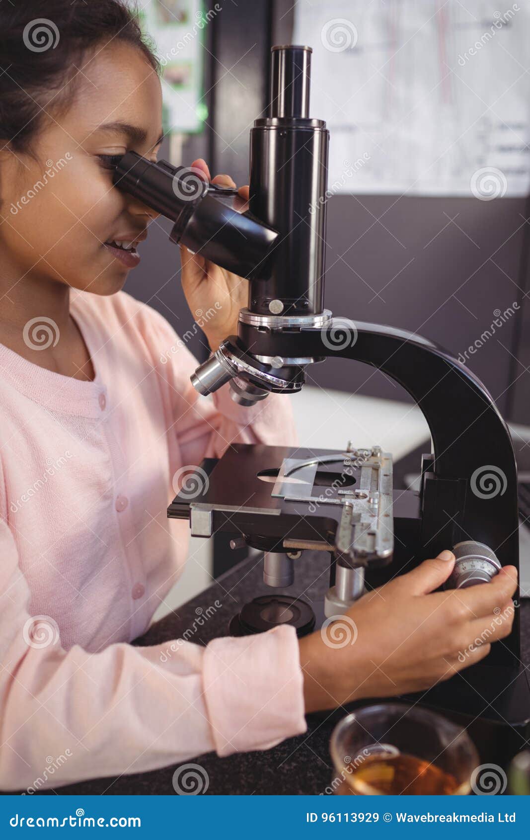 Elementary Student Using Microscope at Laboratory Stock Image - Image ...